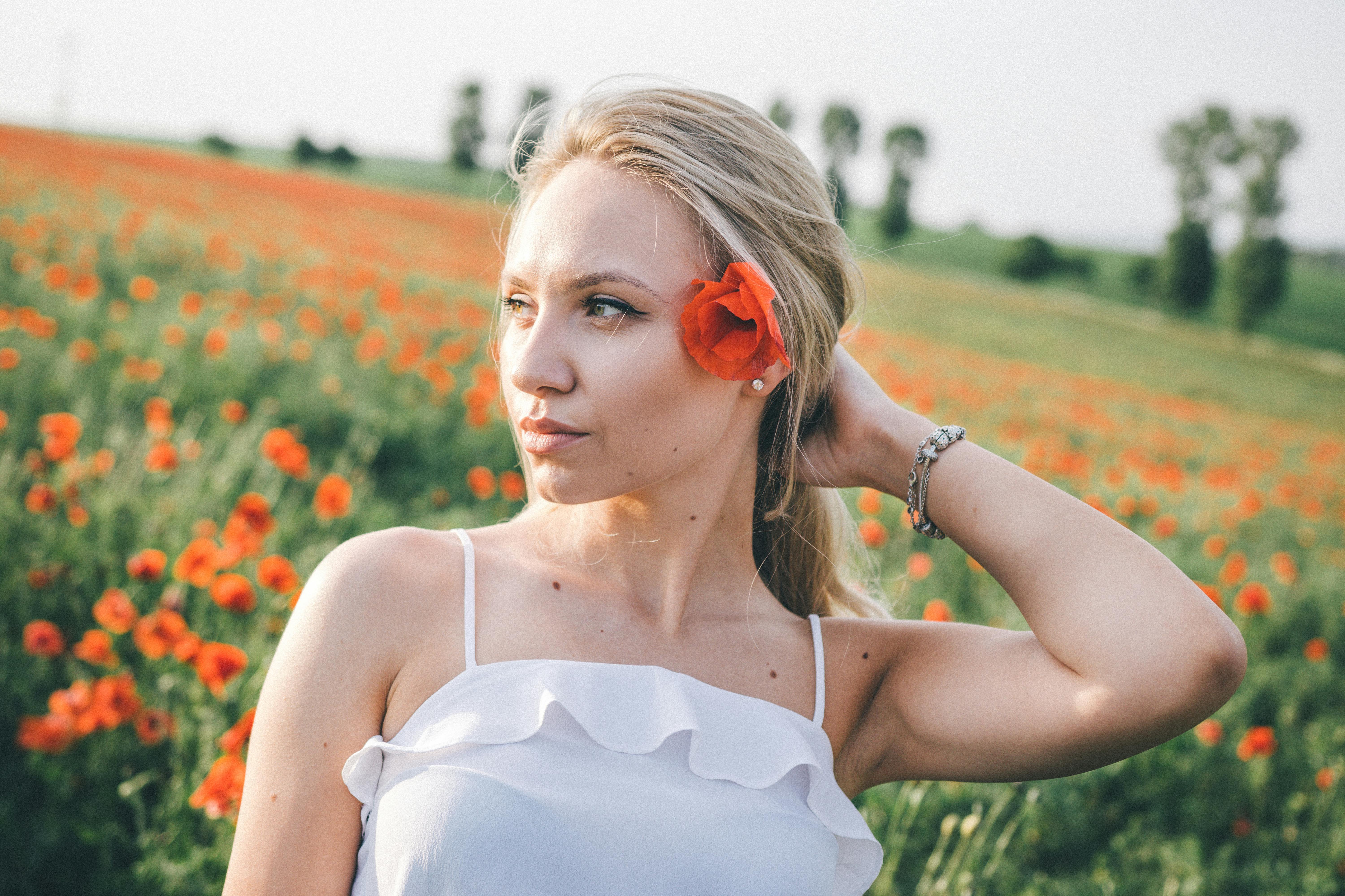 Woman with Flower in Hair · Free Stock Photo