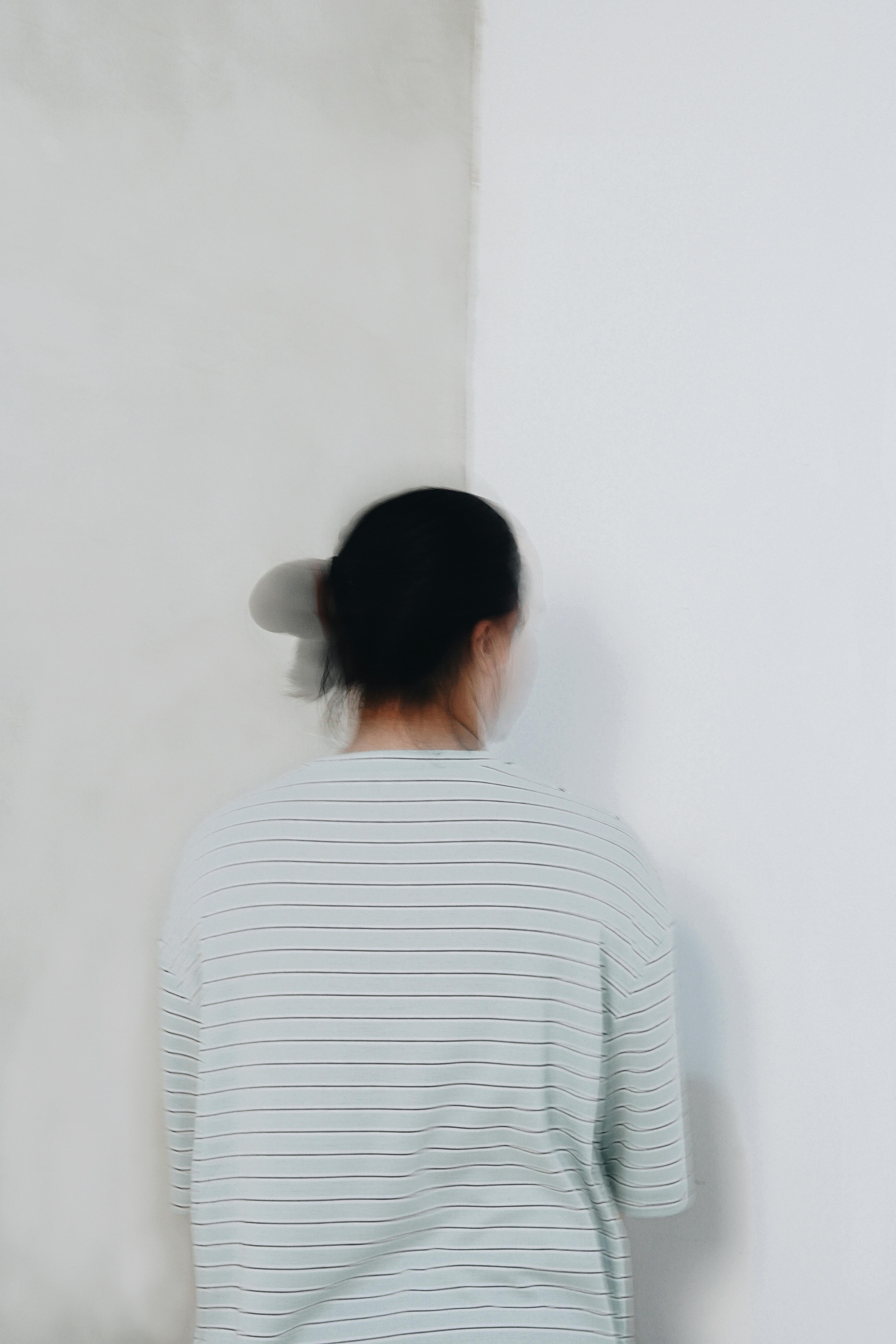 Woman Hiding in Corner · Free Stock Photo