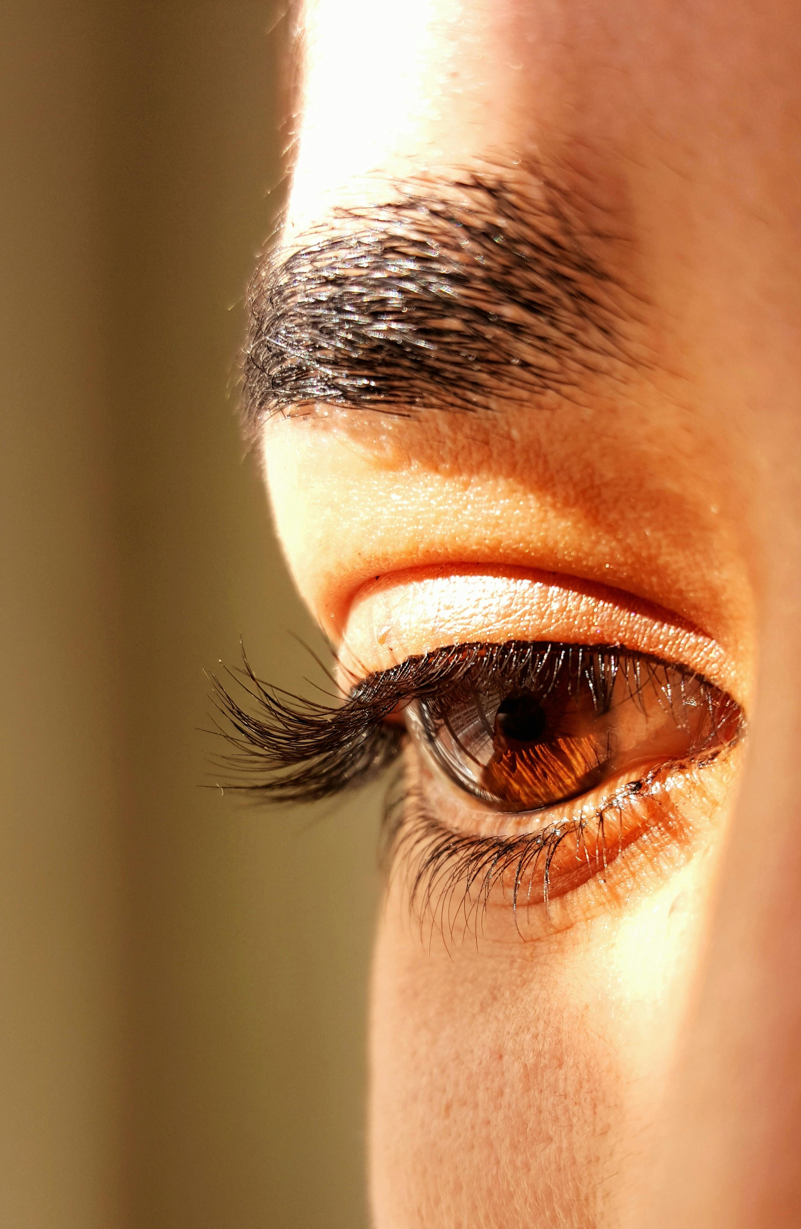 Close-Up Shot of a Person Getting an Eyelash Extensions · Free Stock Photo