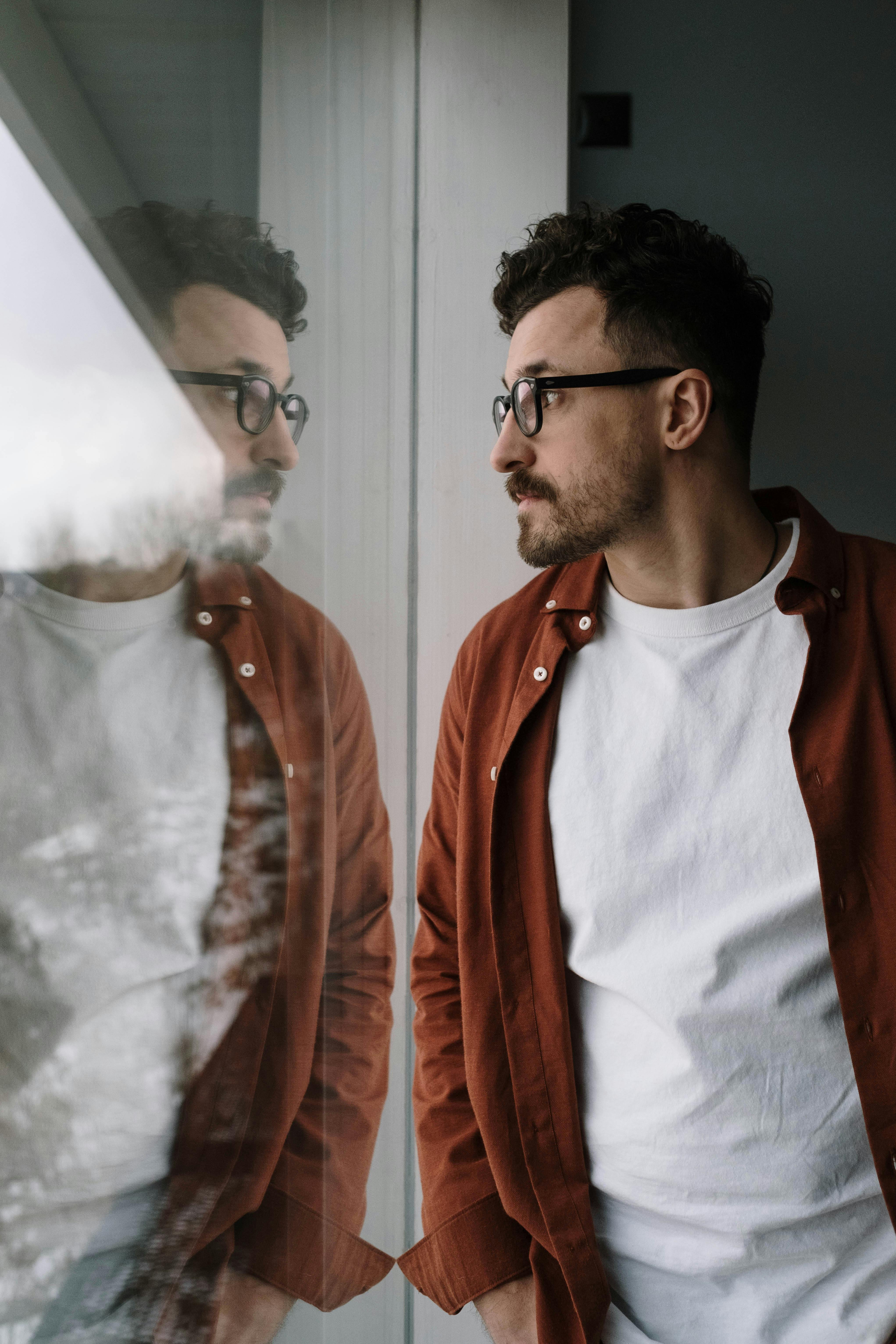Old Man seating beside Bar Counter · Free Stock Photo