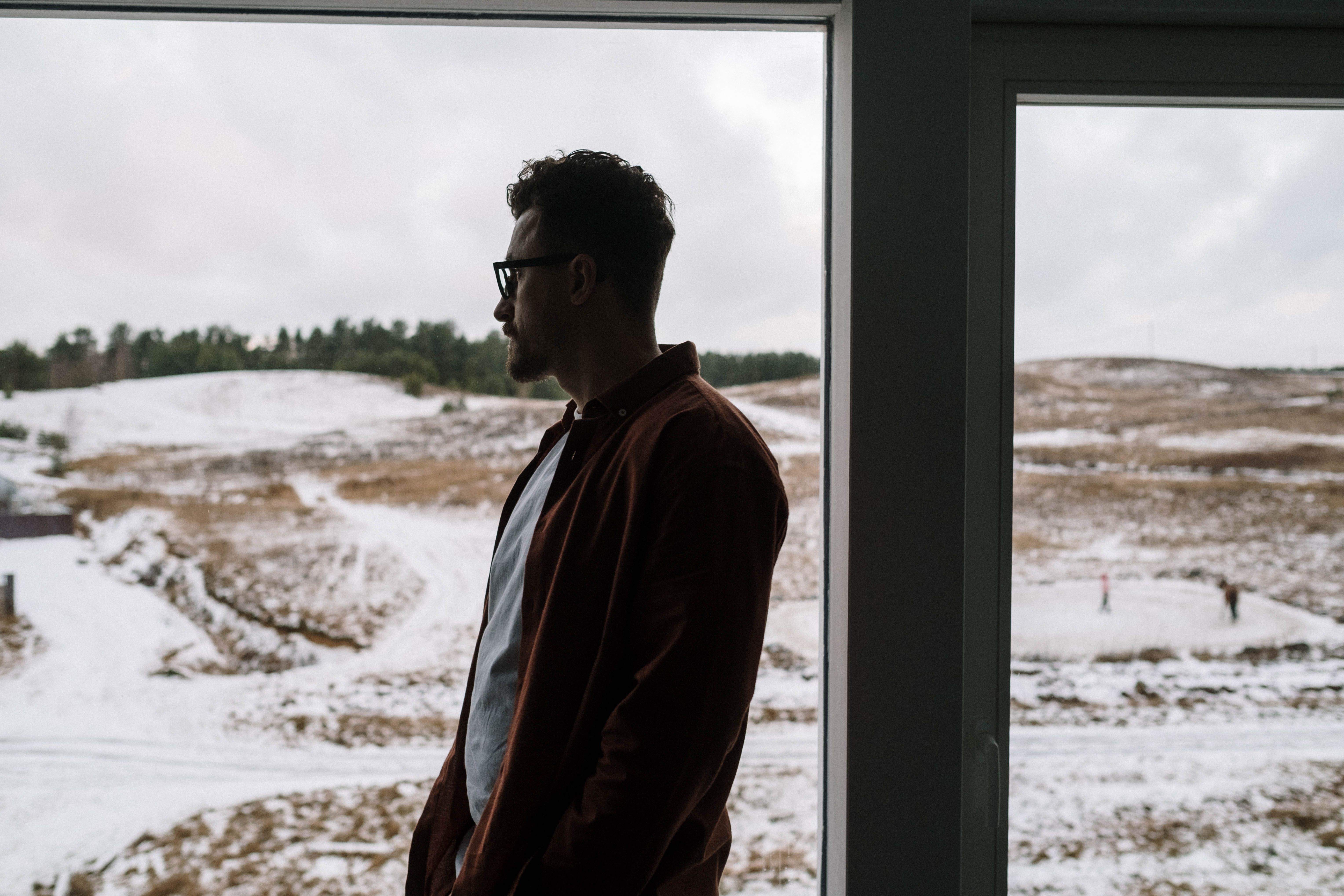 Photo of Man Standing Near Wall · Free Stock Photo