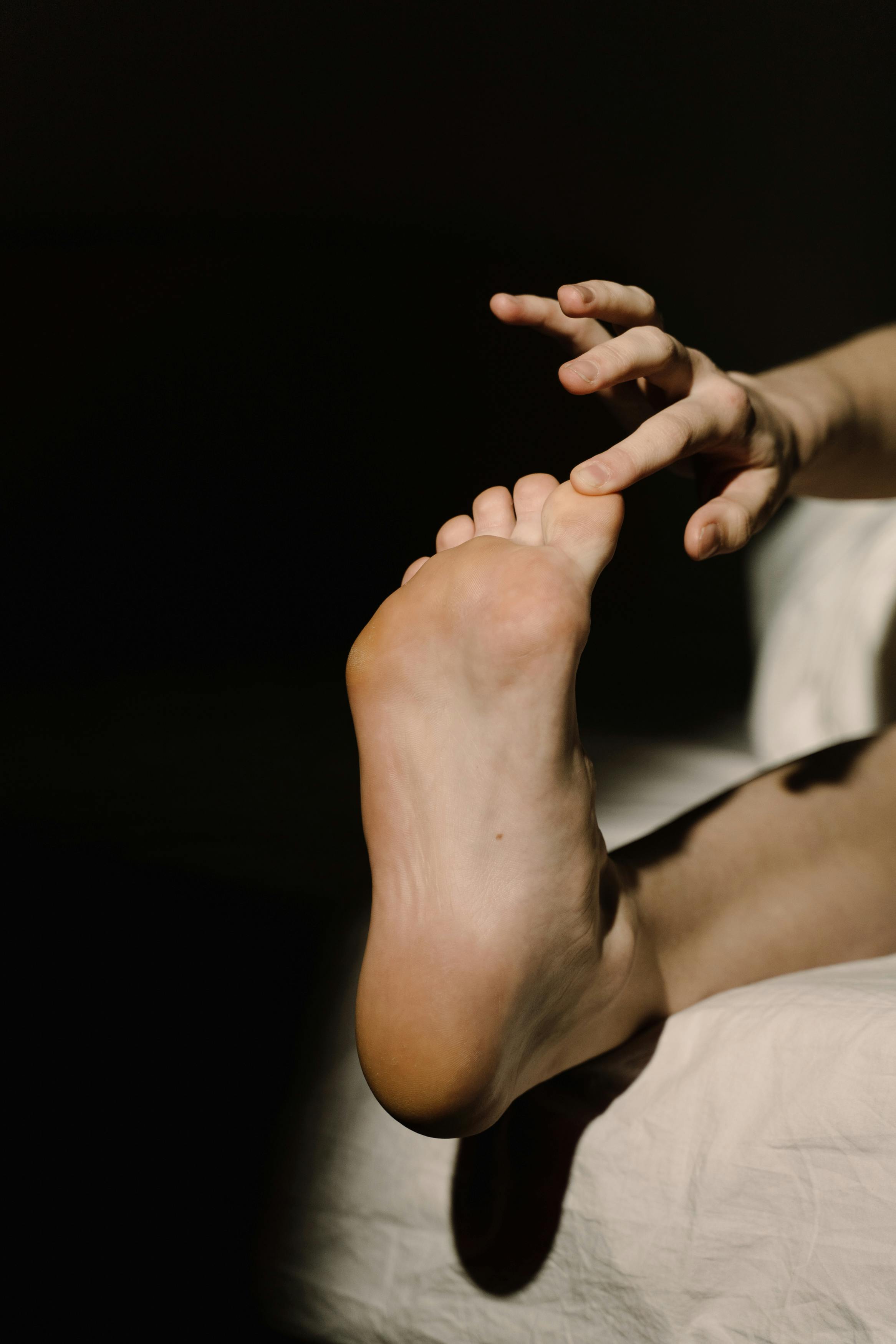 Touching the Foot · Free Stock Photo