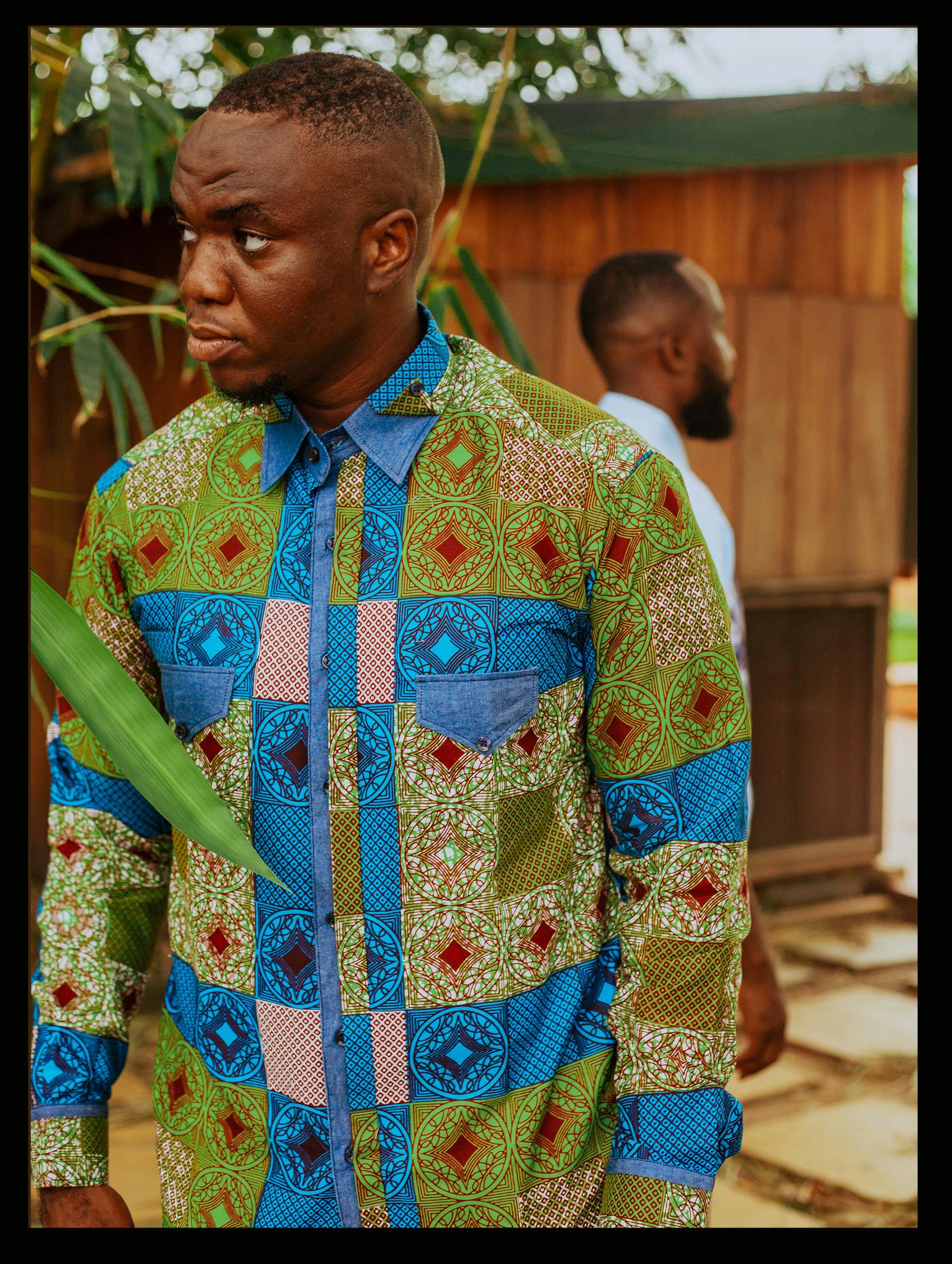 Black Man In Traditional Apparel With Ornament Against Friend Free black-man-in-traditional-apparel-with-ornament-against-friend-free
