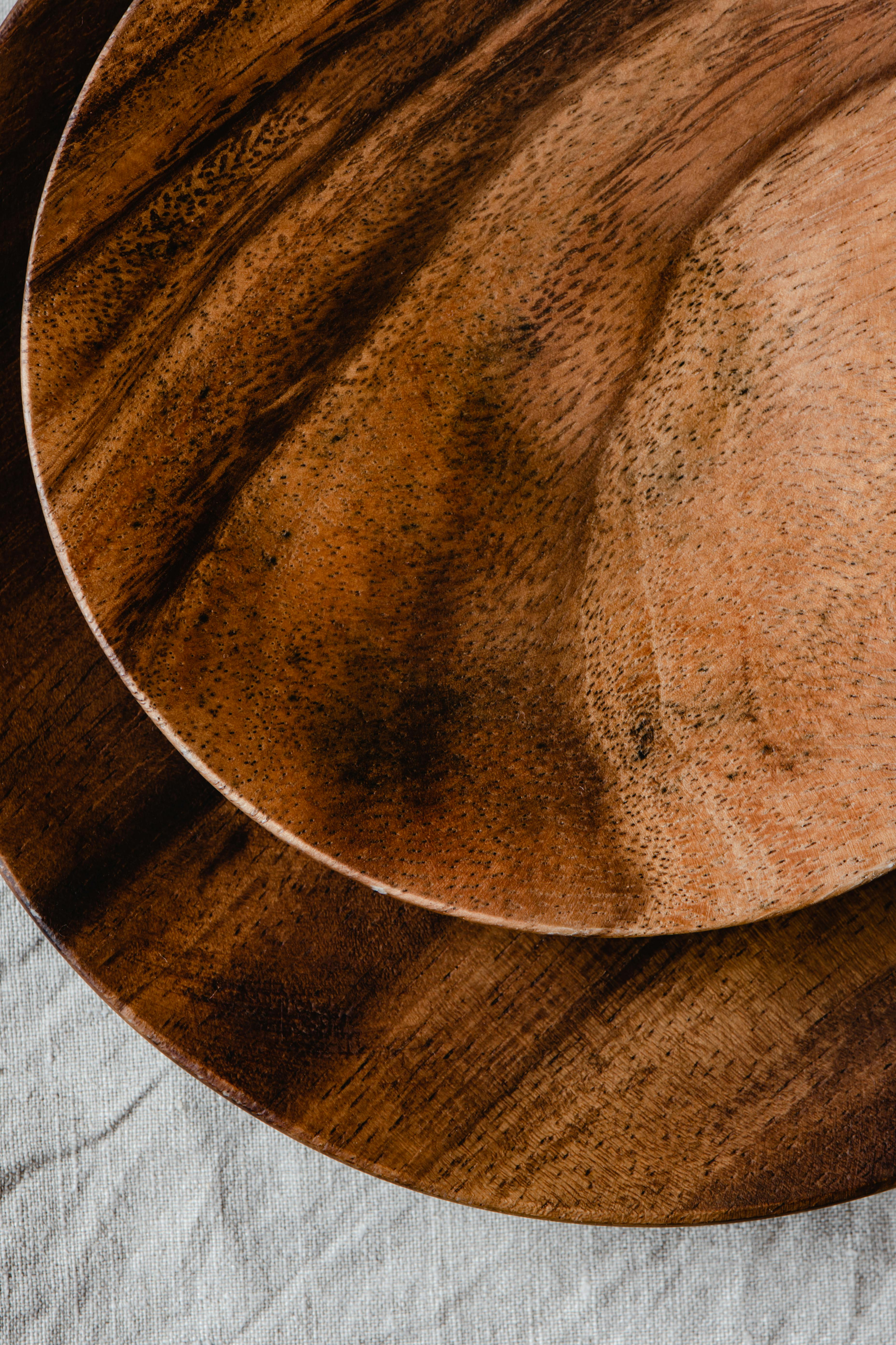 A Close-Up Shot of Wooden Plates · Free Stock Photo