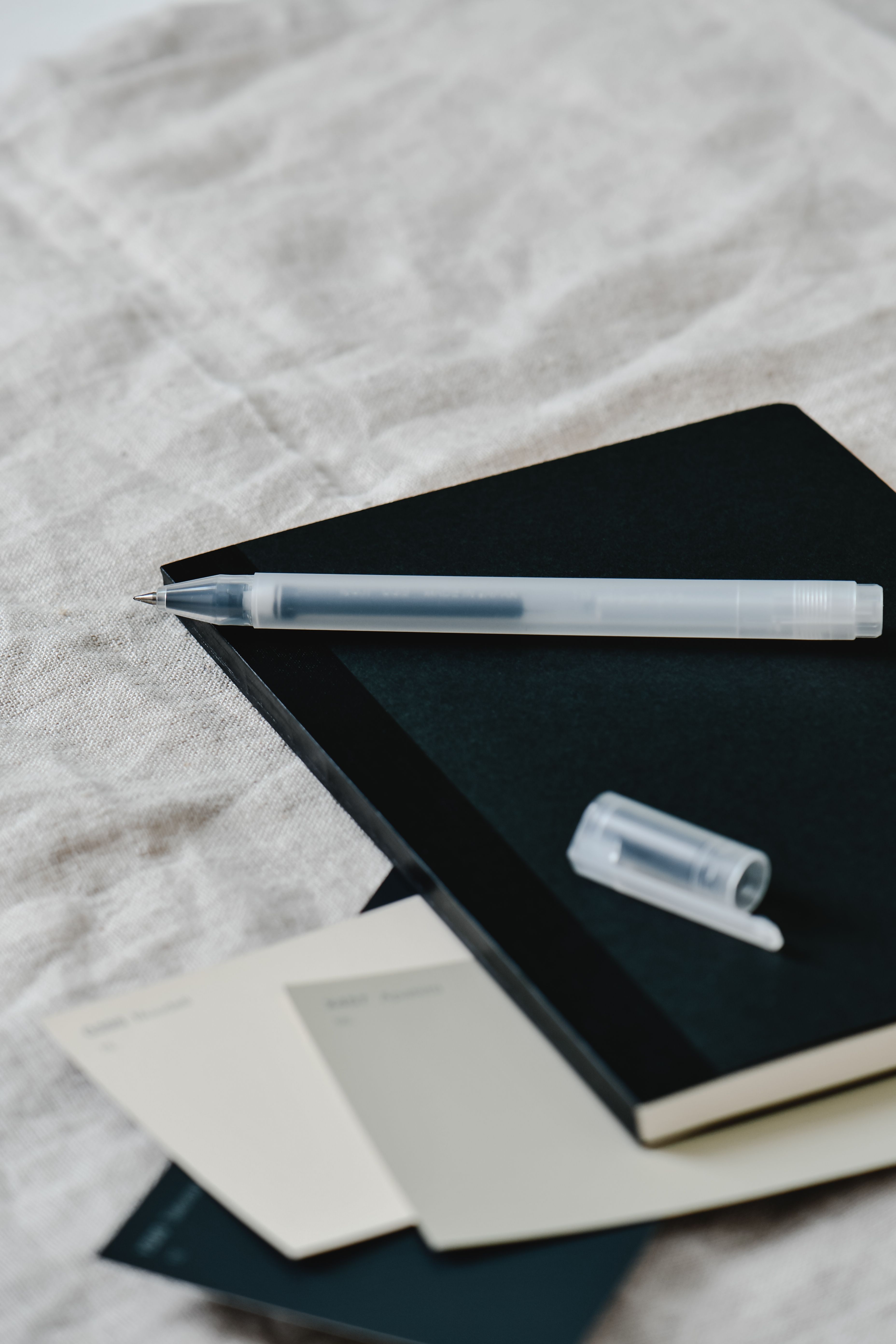Black Pen on Black Notebook · Free Stock Photo