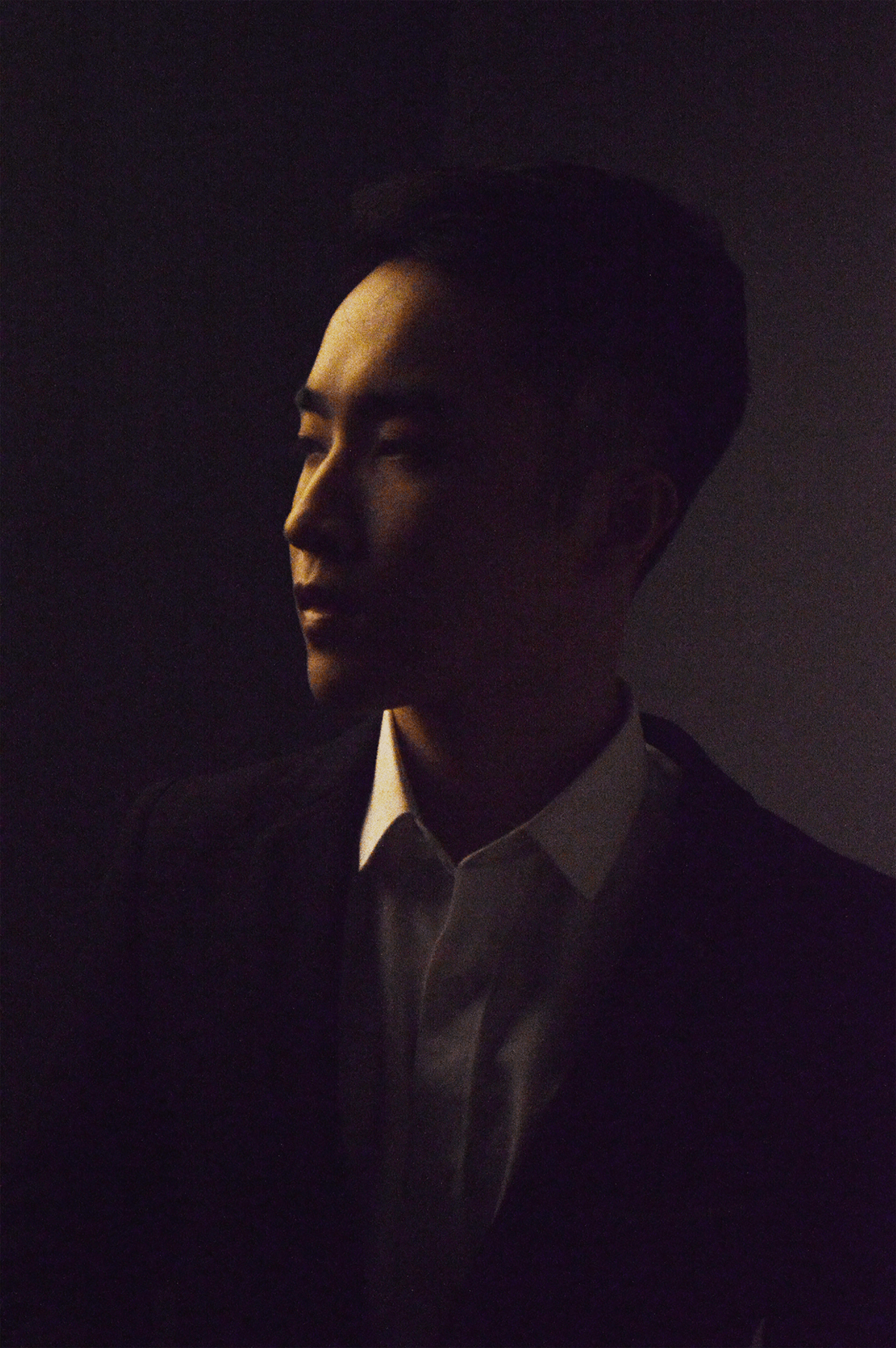 Dark Portrait of a Man in a Suit · Free Stock Photo