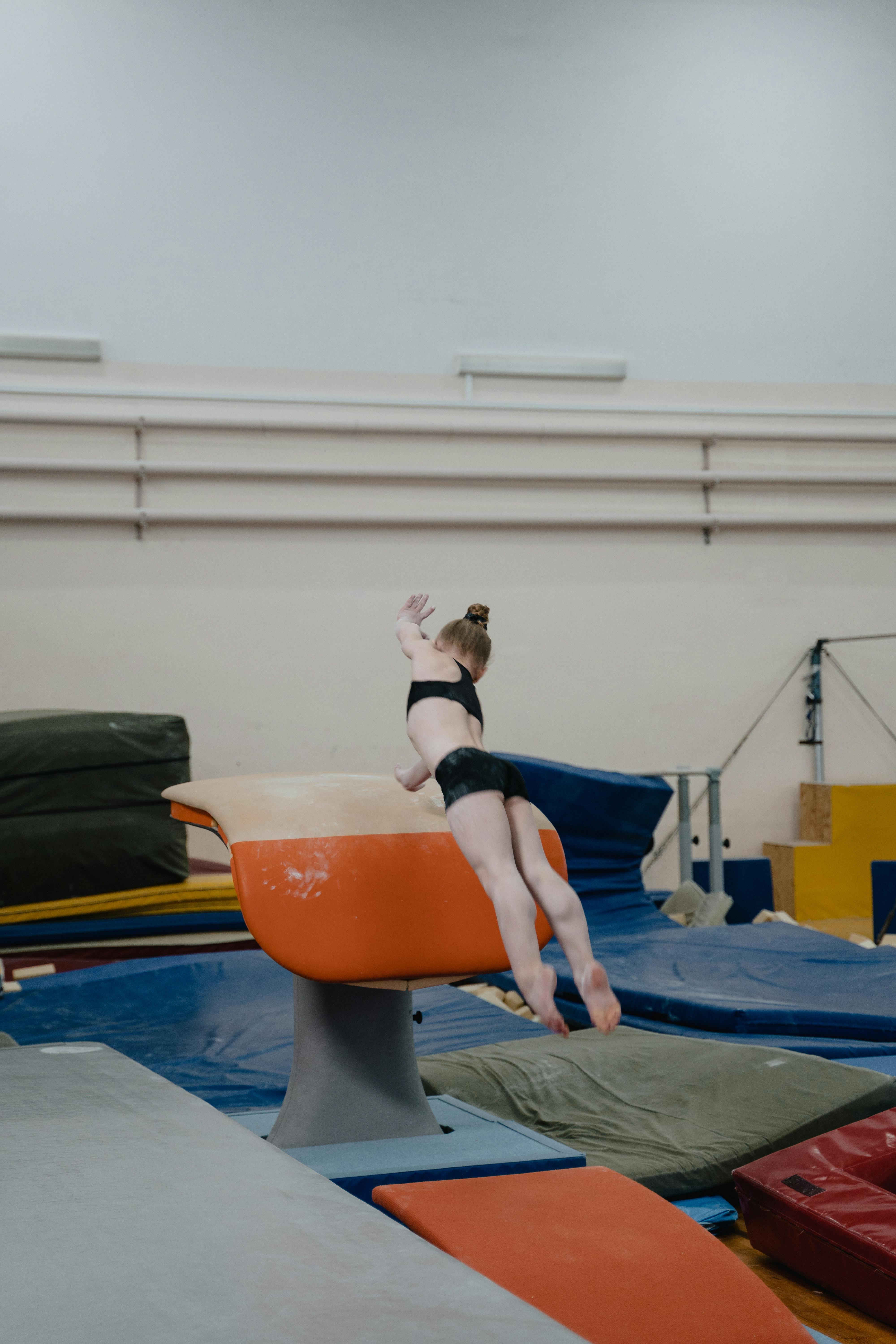 A Girl Doing Gymnastics on a Vaulting Table · Free Stock Photo