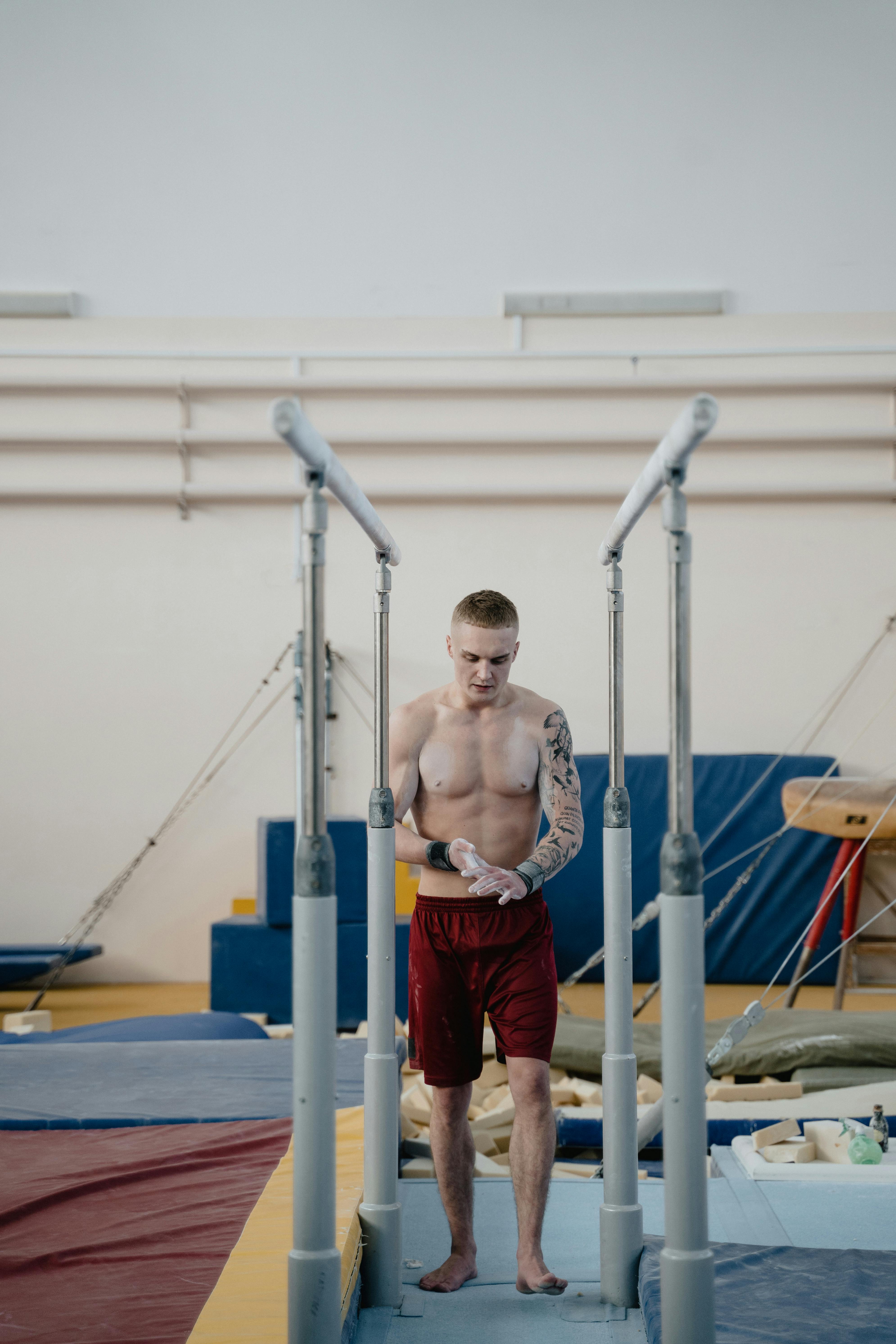 A Young Man Walking Towards Parallel Bars · Free Stock Photo