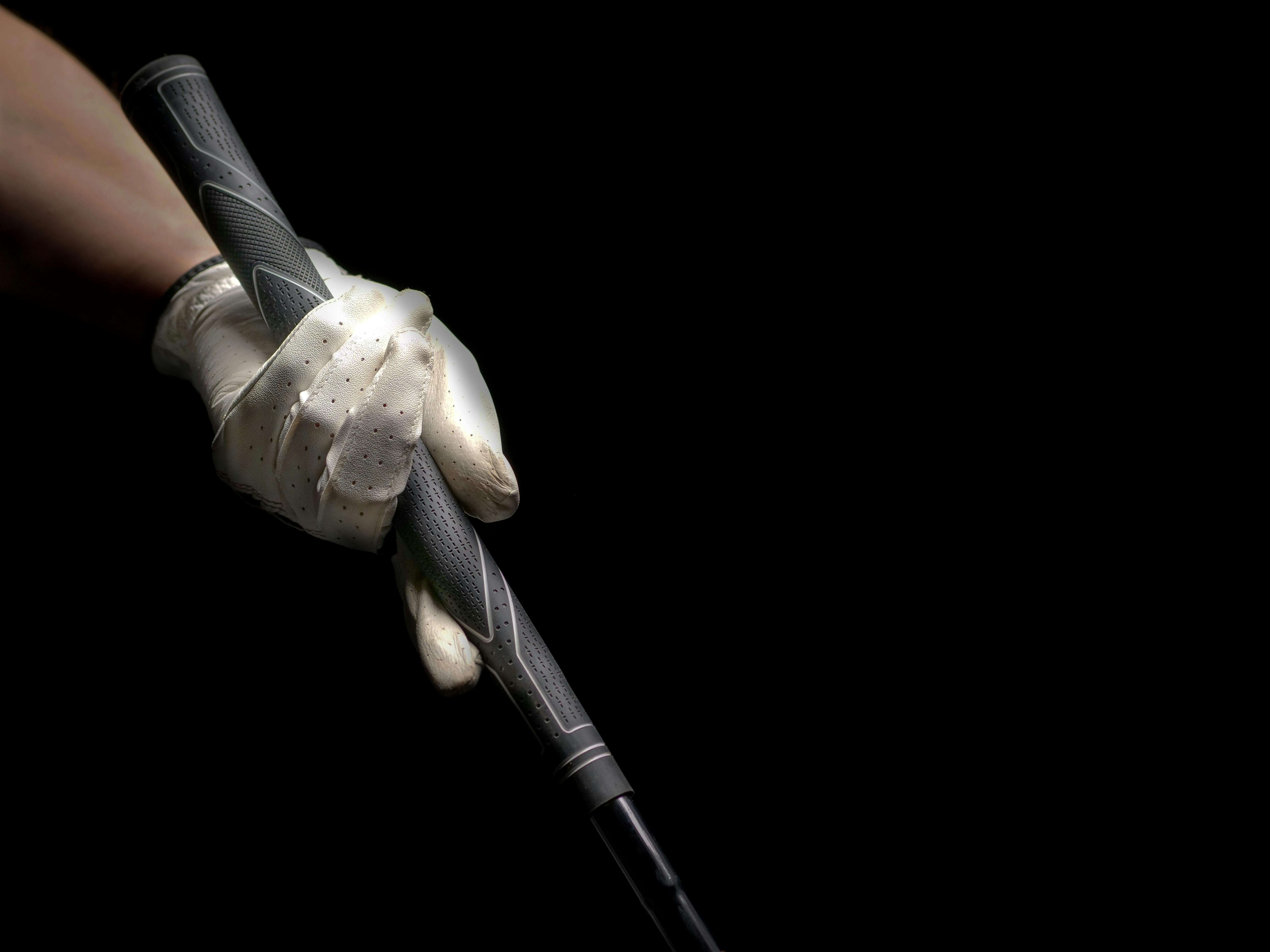 Photo of Person Holding a Golf Club · Free Stock Photo