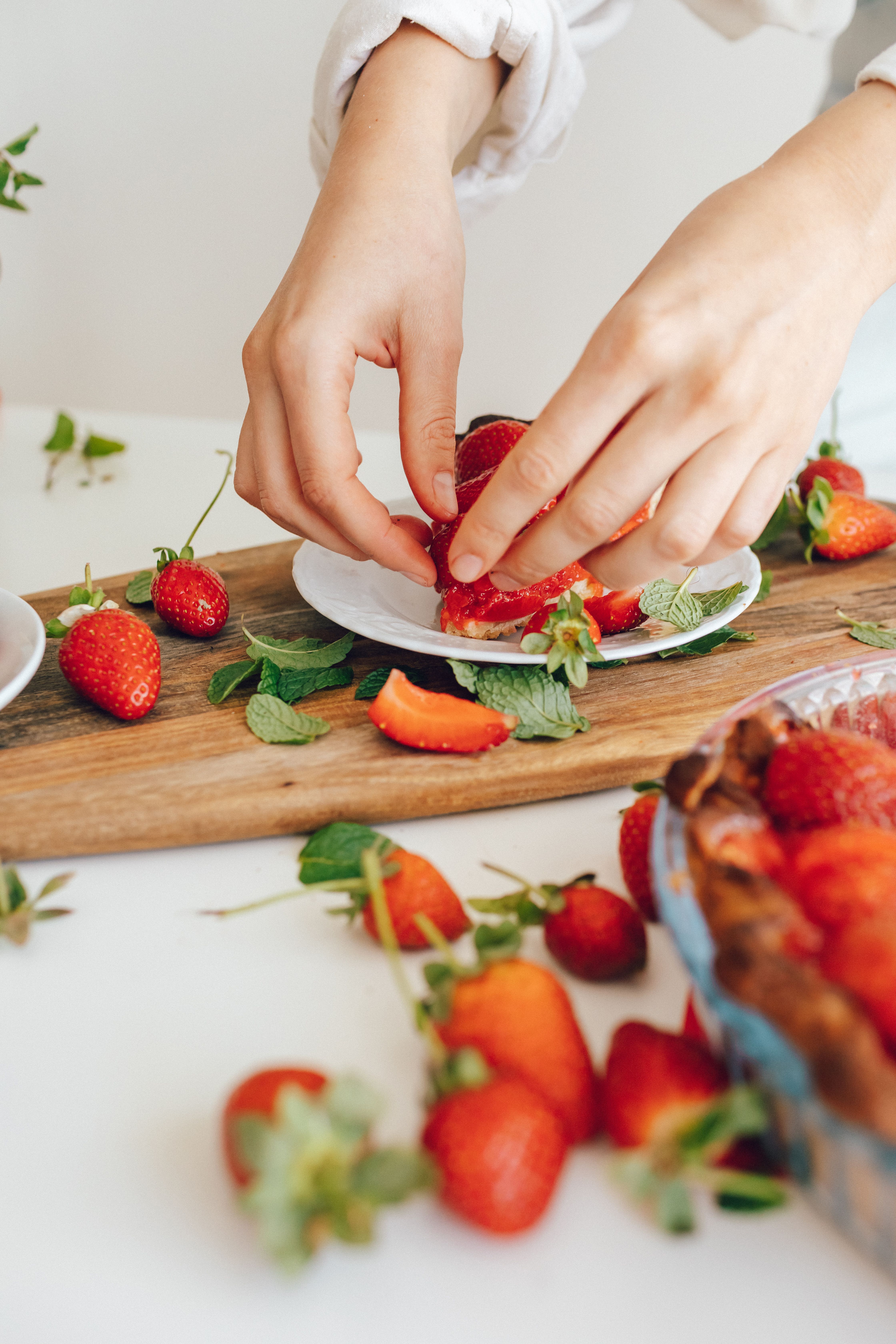 Person Preparing Dessert on Plate · Free Stock Photo