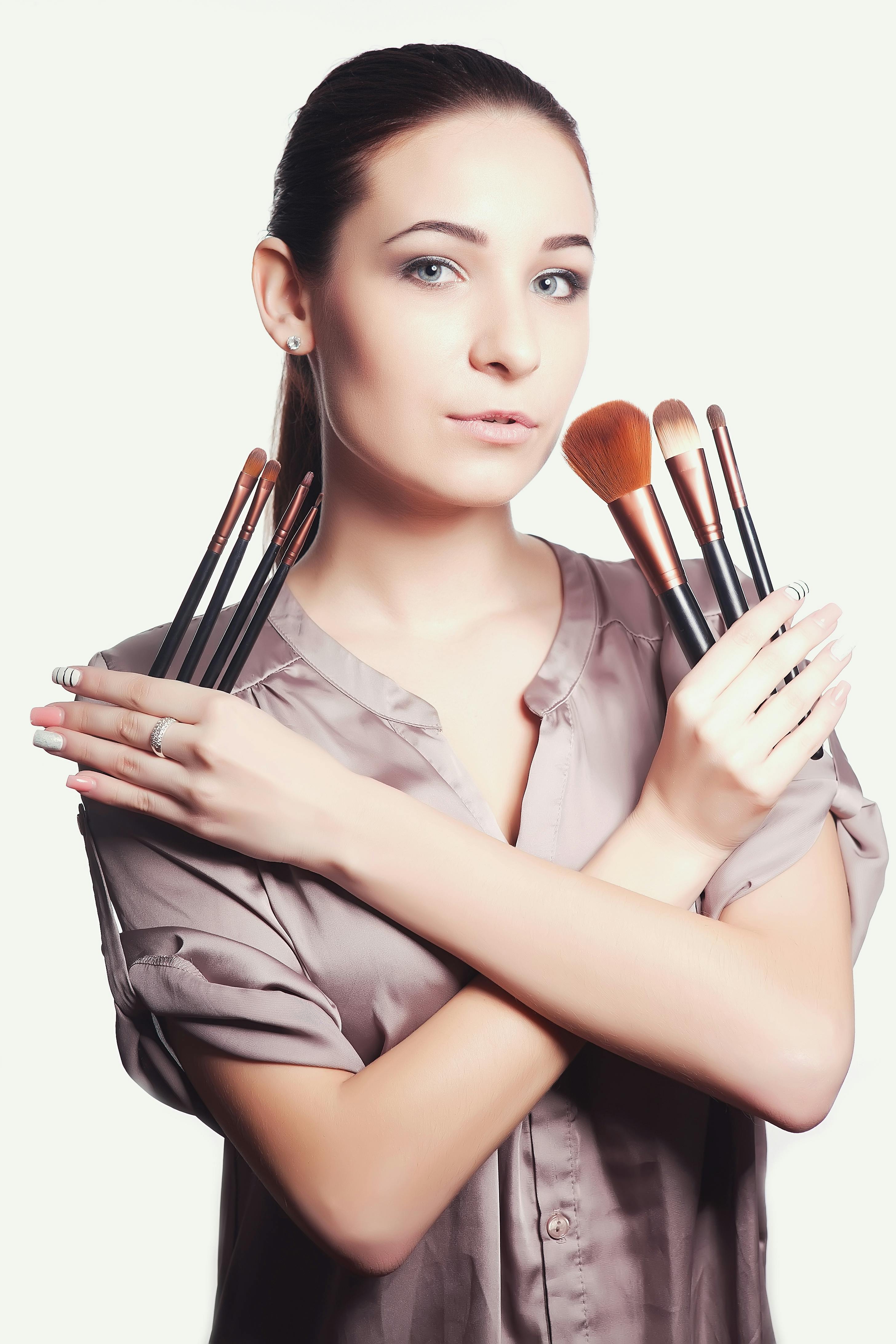 Woman Applying Makeup on Her Face · Free Stock Photo