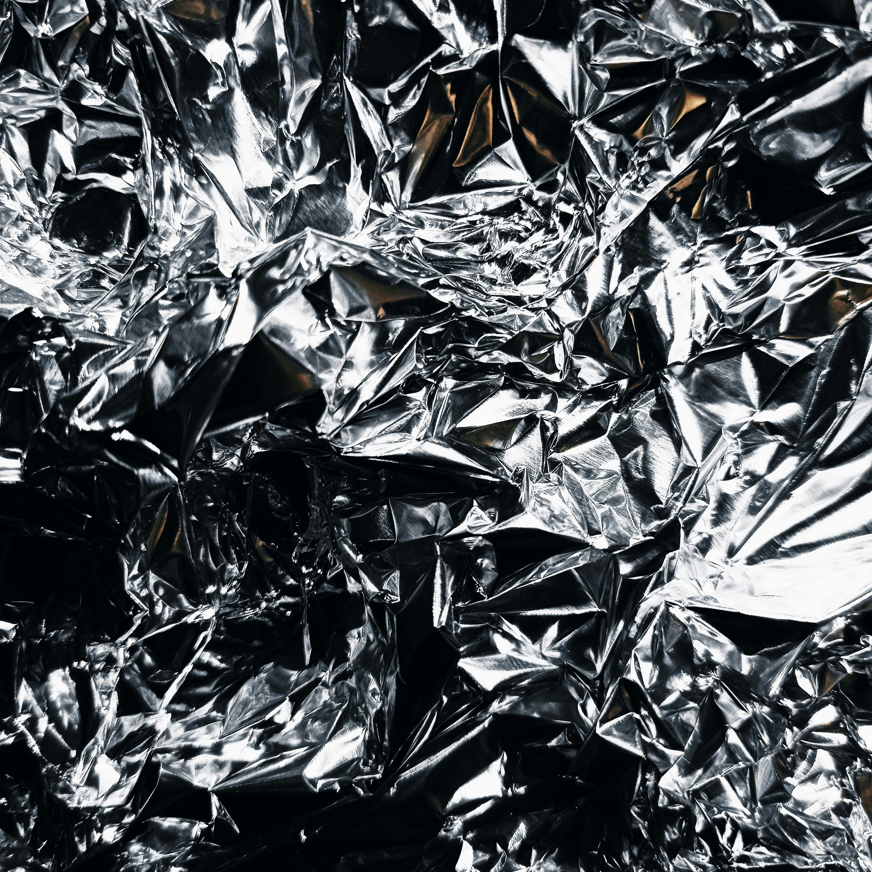Close-Up Shot of a Wrinkled Foil · Free Stock Photo