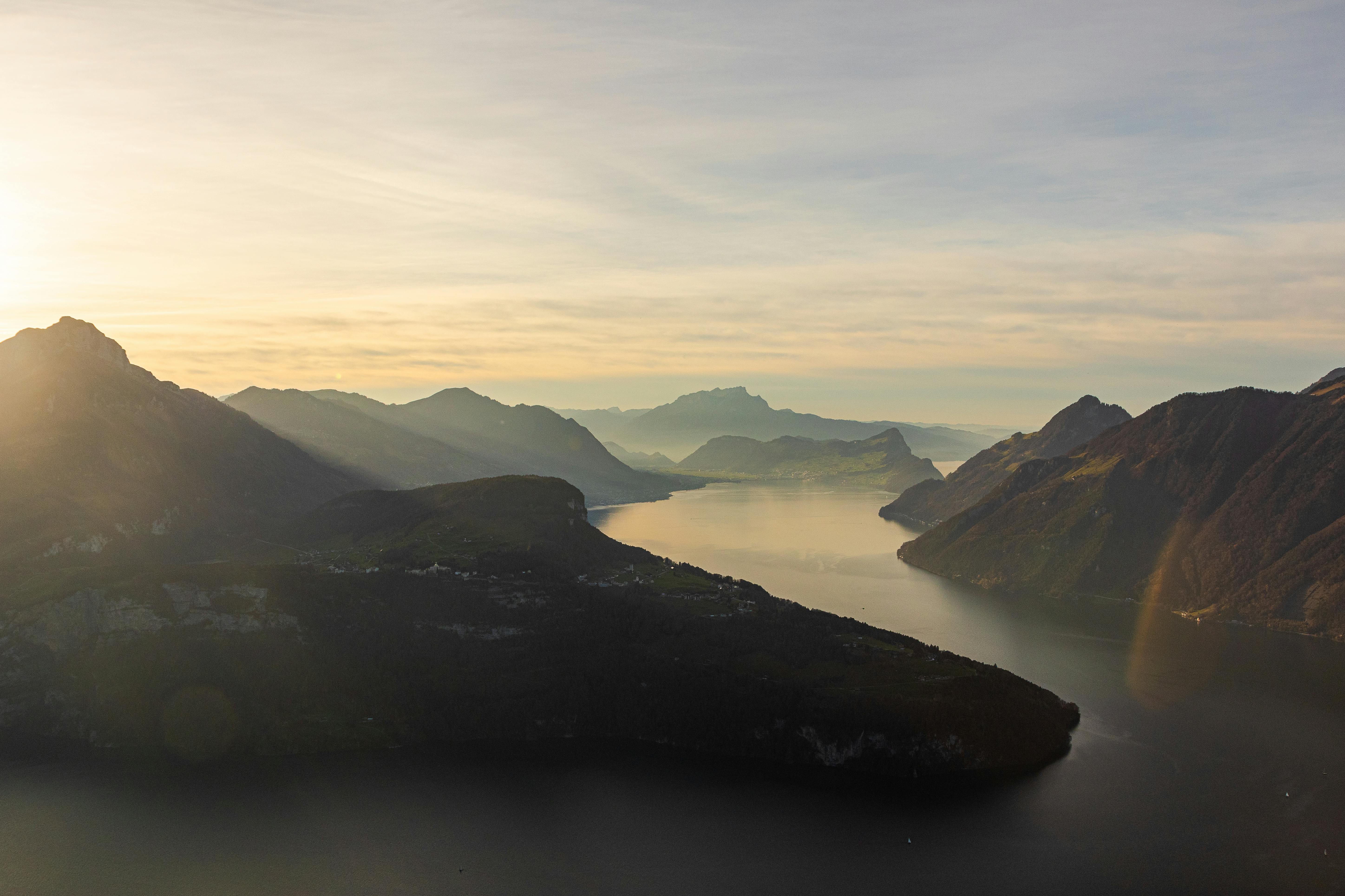 Sun Setting in Calm Still Water · Free Stock Photo