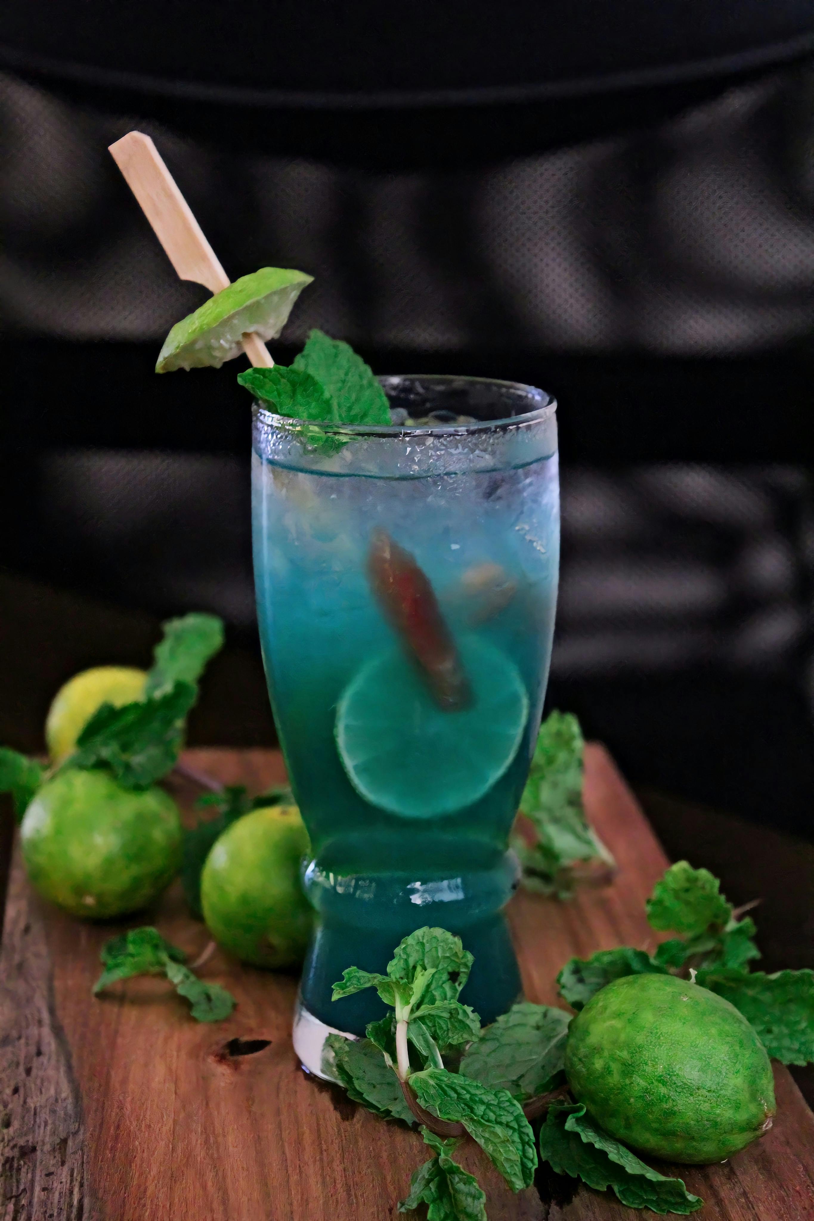 Woman Stirring Lemonade with a Straw · Free Stock Photo