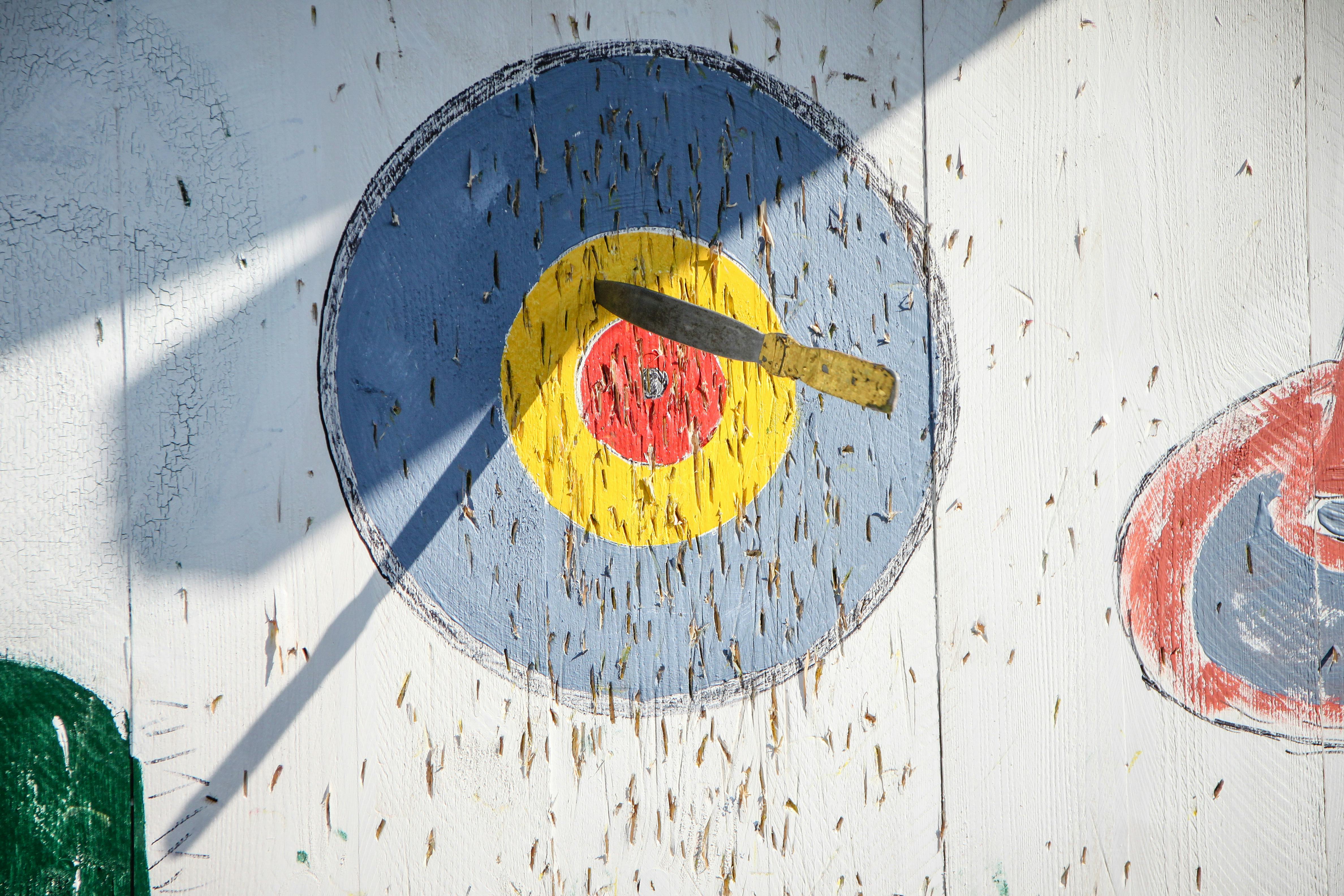 Person Holding a Paper Target · Free Stock Photo