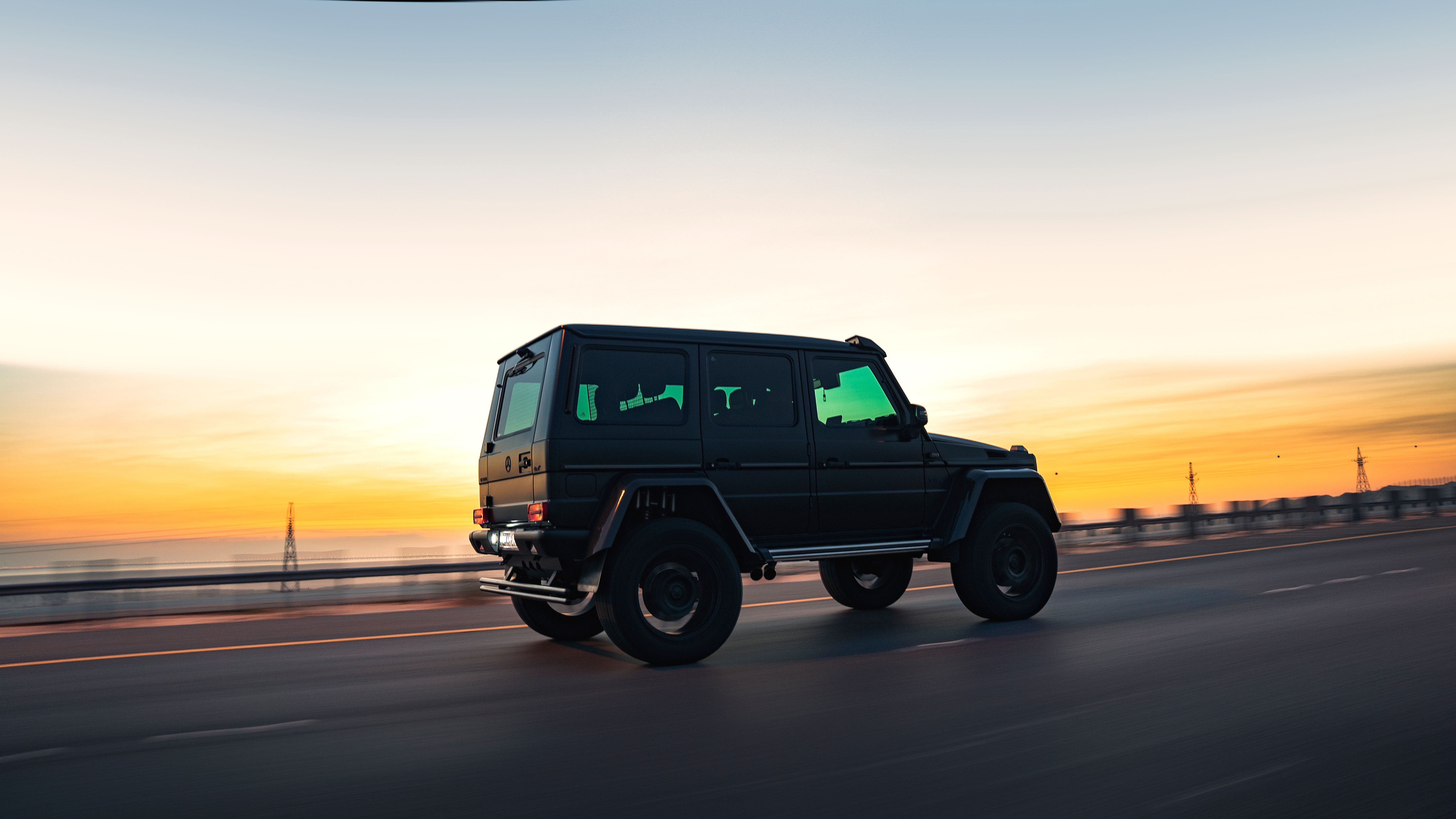 4x4 Car Driving along a Road at Sunset · Free Stock Photo