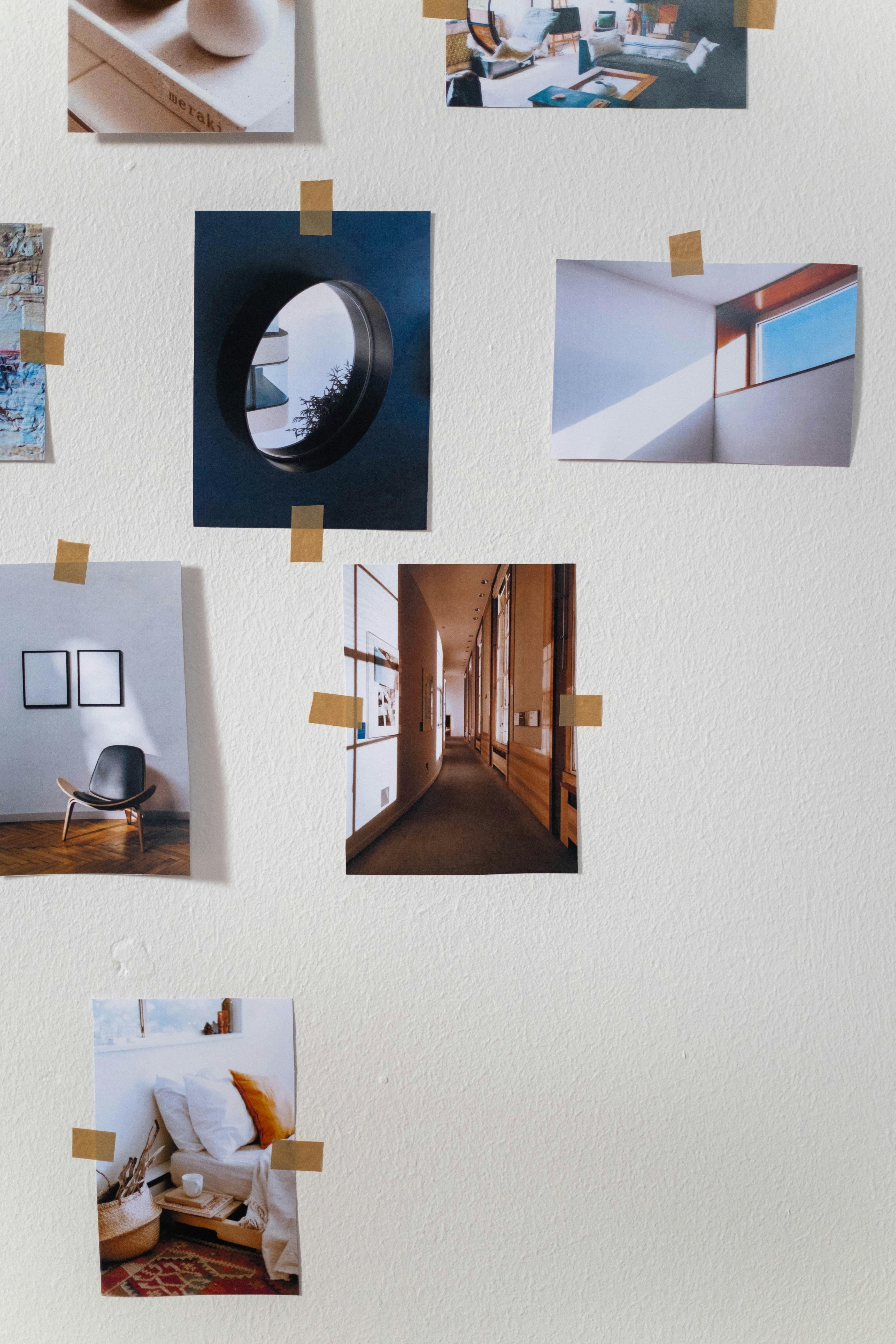 Person sticking a Picture on a Wall · Free Stock Photo