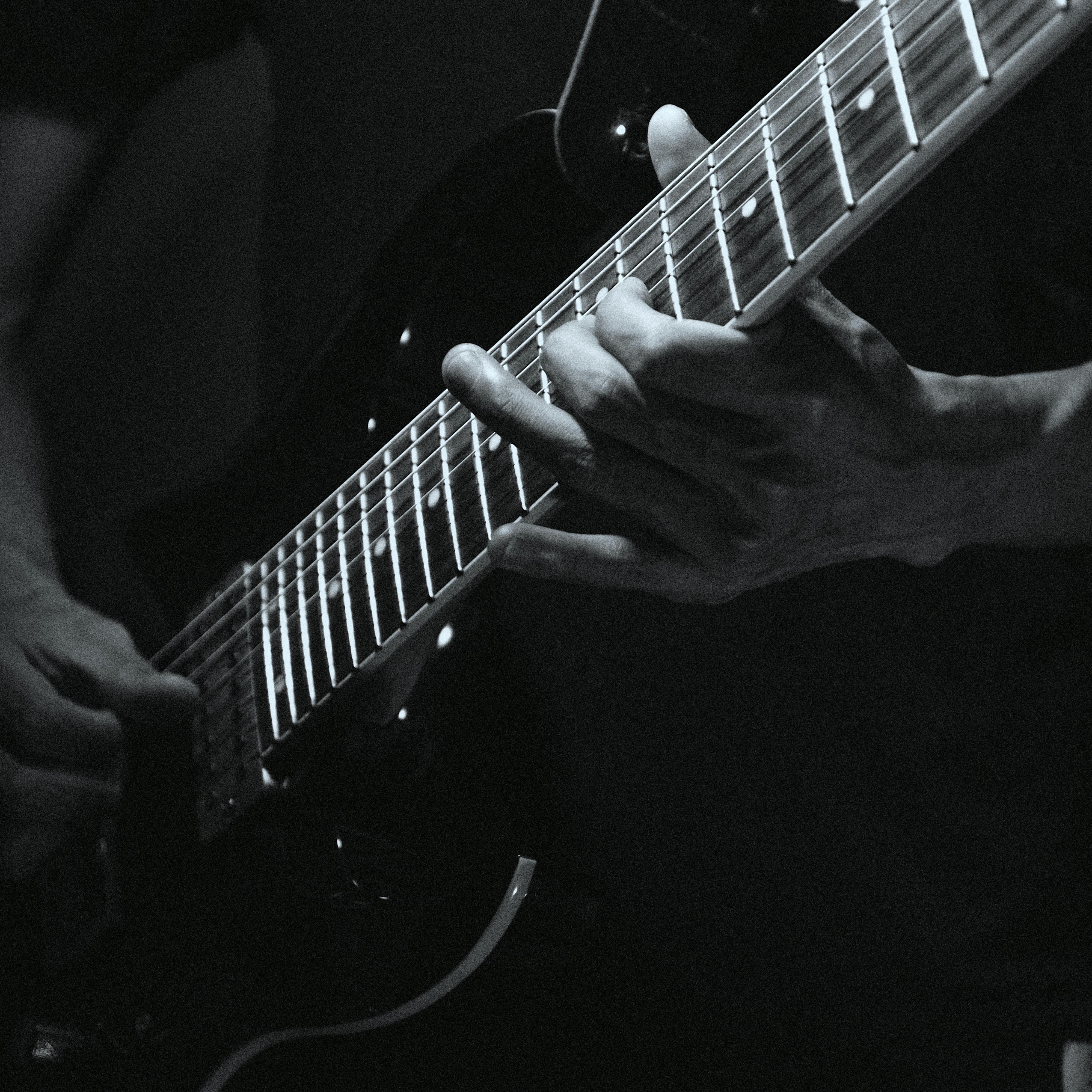 Close-up Photo of Person playing electric Guitar · Free Stock Photo