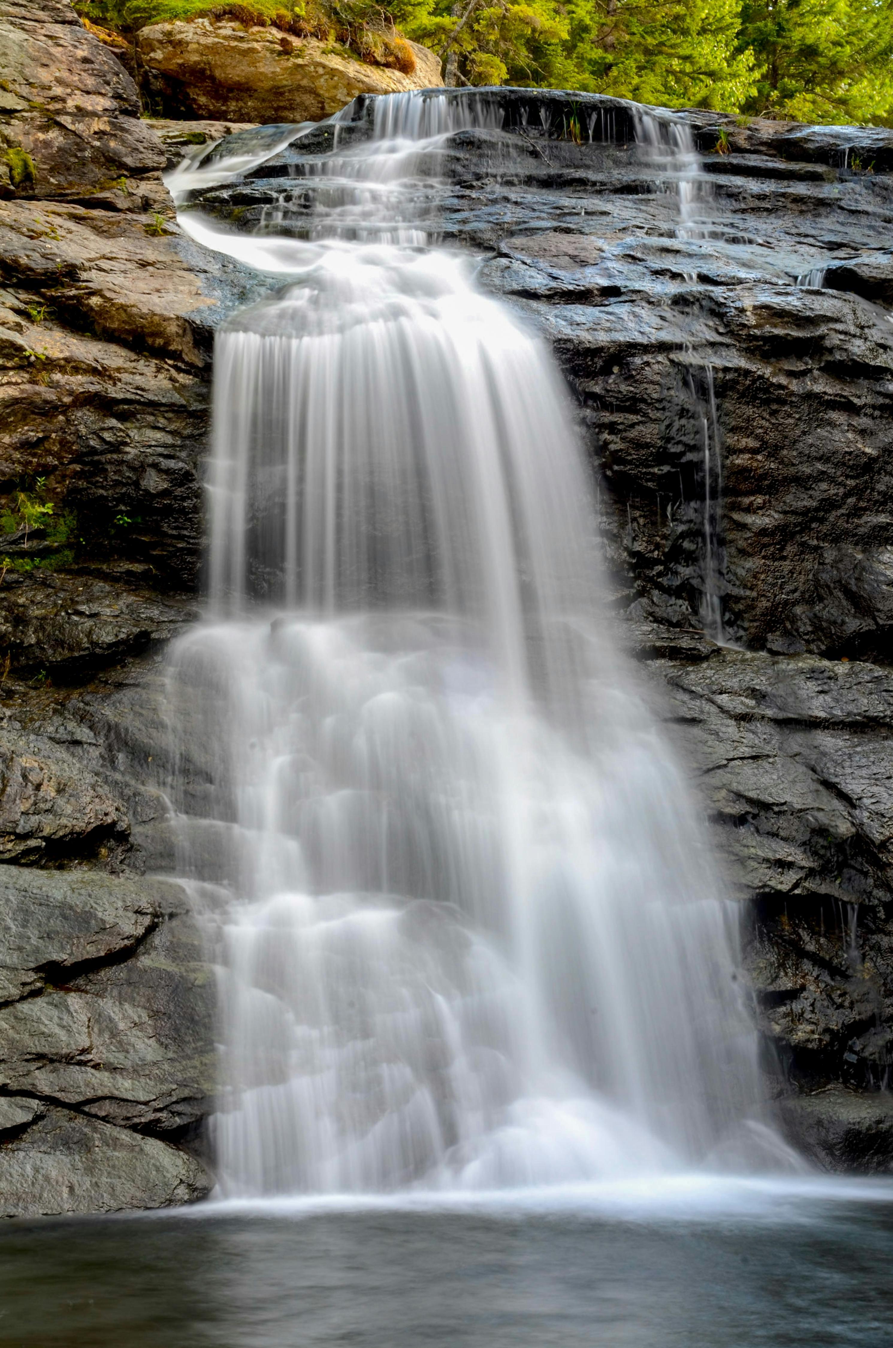Waterfalls between Rocky Mountains · Free Stock Photo