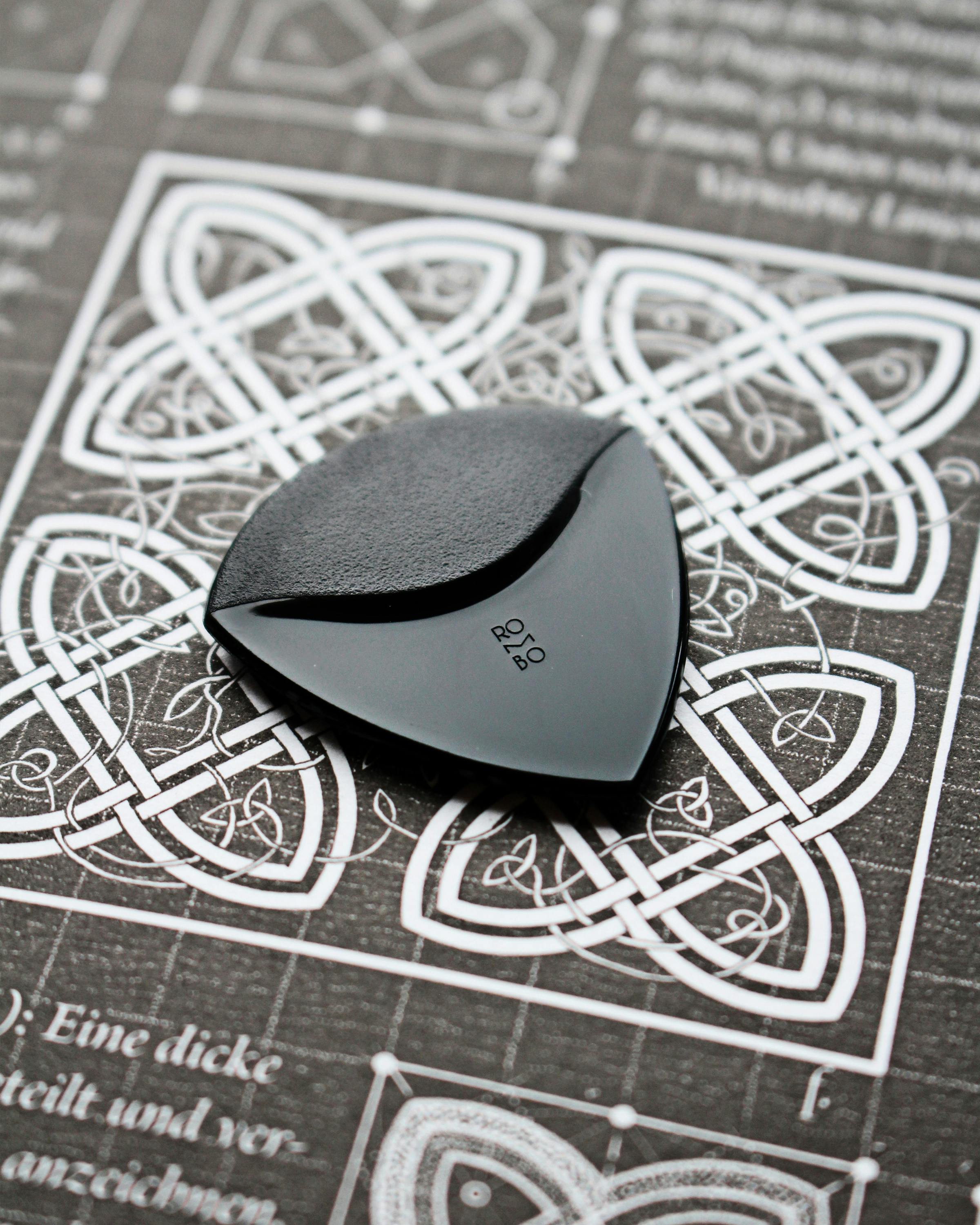 Close-Up Shot of a Guitar Pick · Free Stock Photo