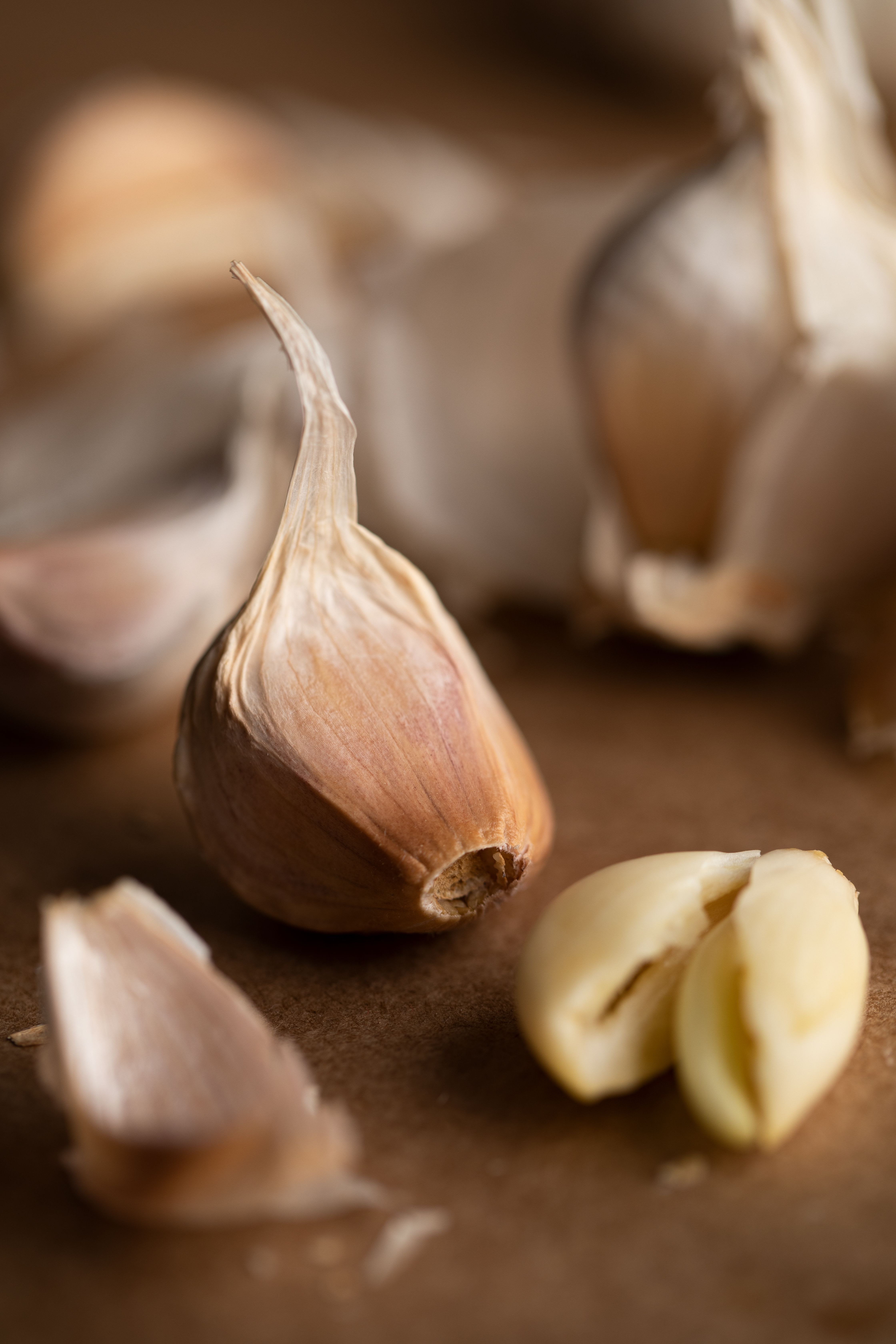 Gloves of Garlic Wooden Surface · Free Stock Photo