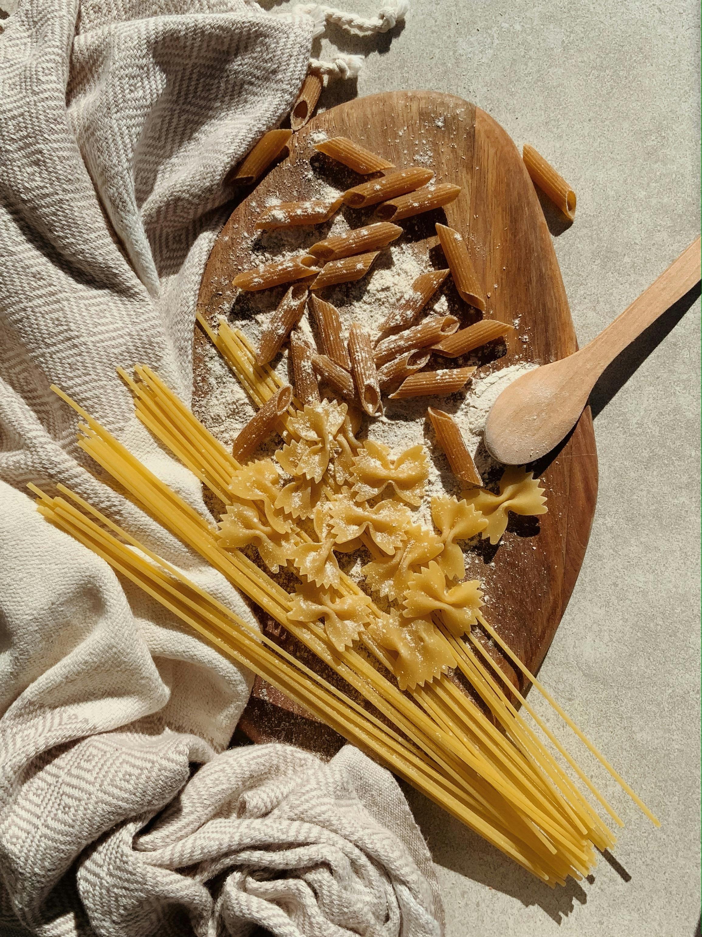 Homemade Pasta Sorts on Wooden Board · Free Stock Photo
