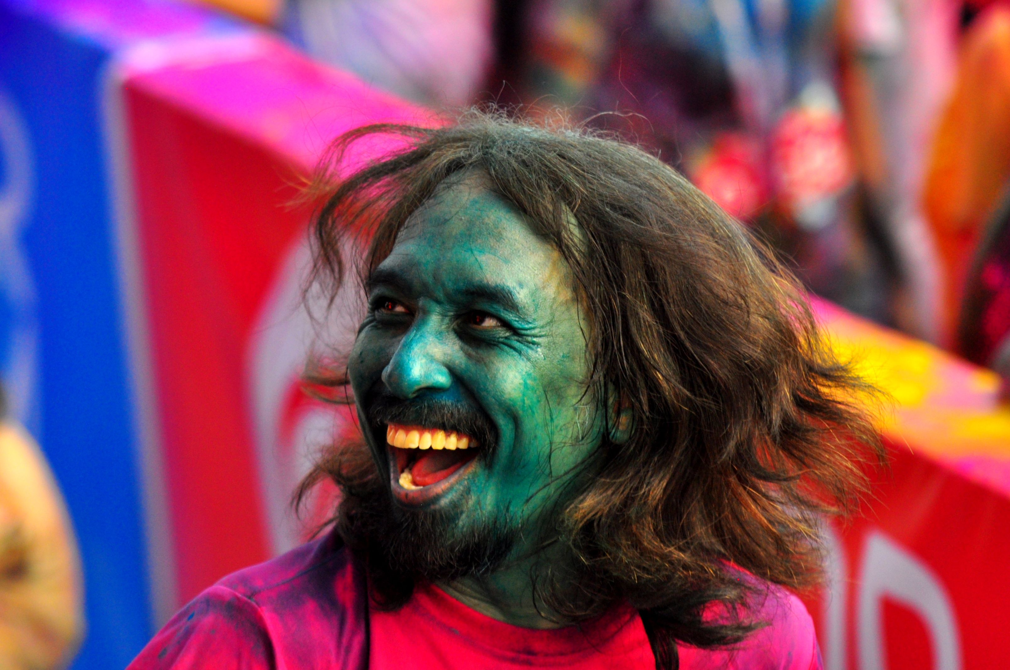 A Man's Face Covered in Green · Free Stock Photo