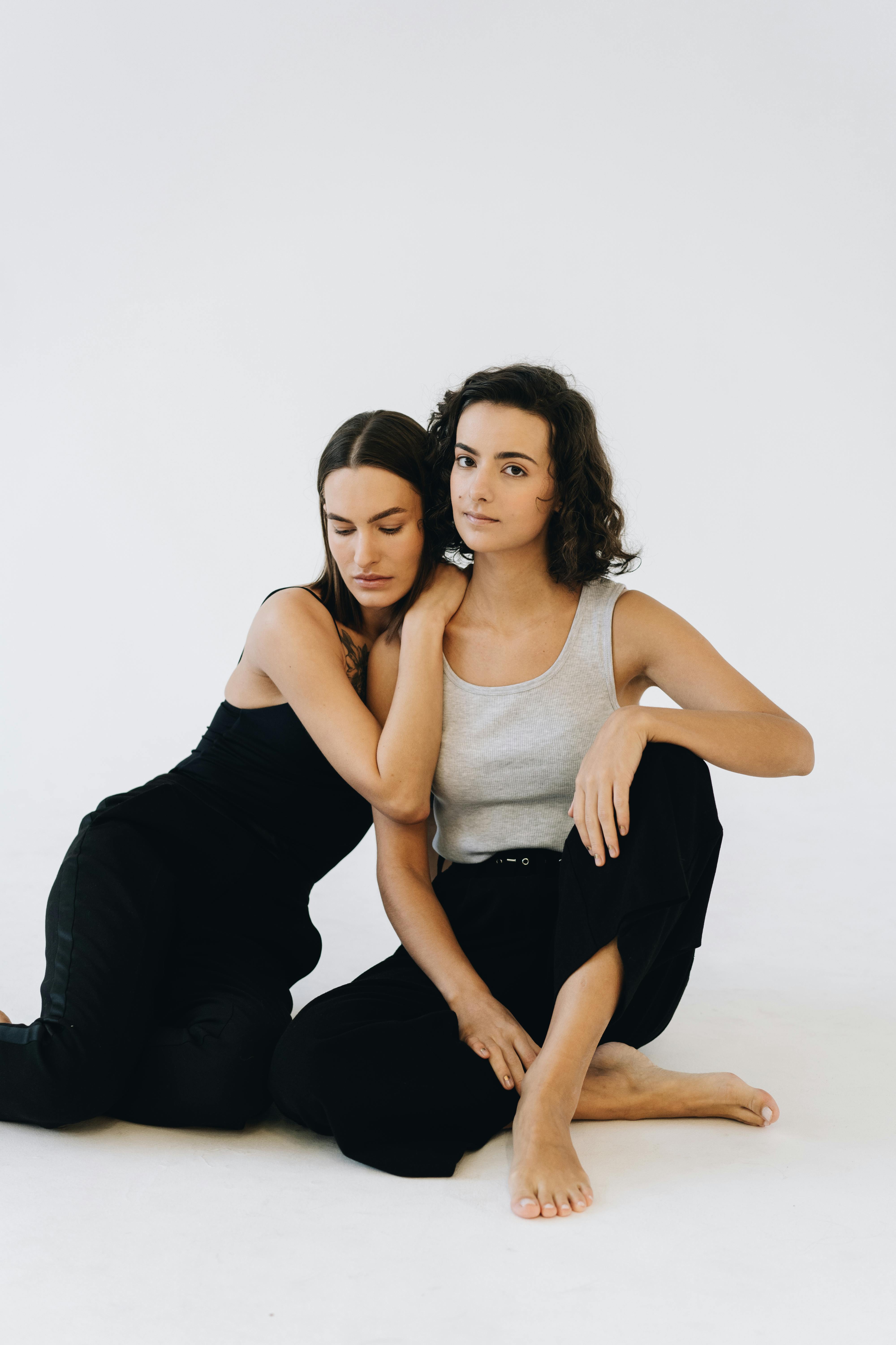 Women Sitting Beside Each Other on the Floor · Free Stock Photo