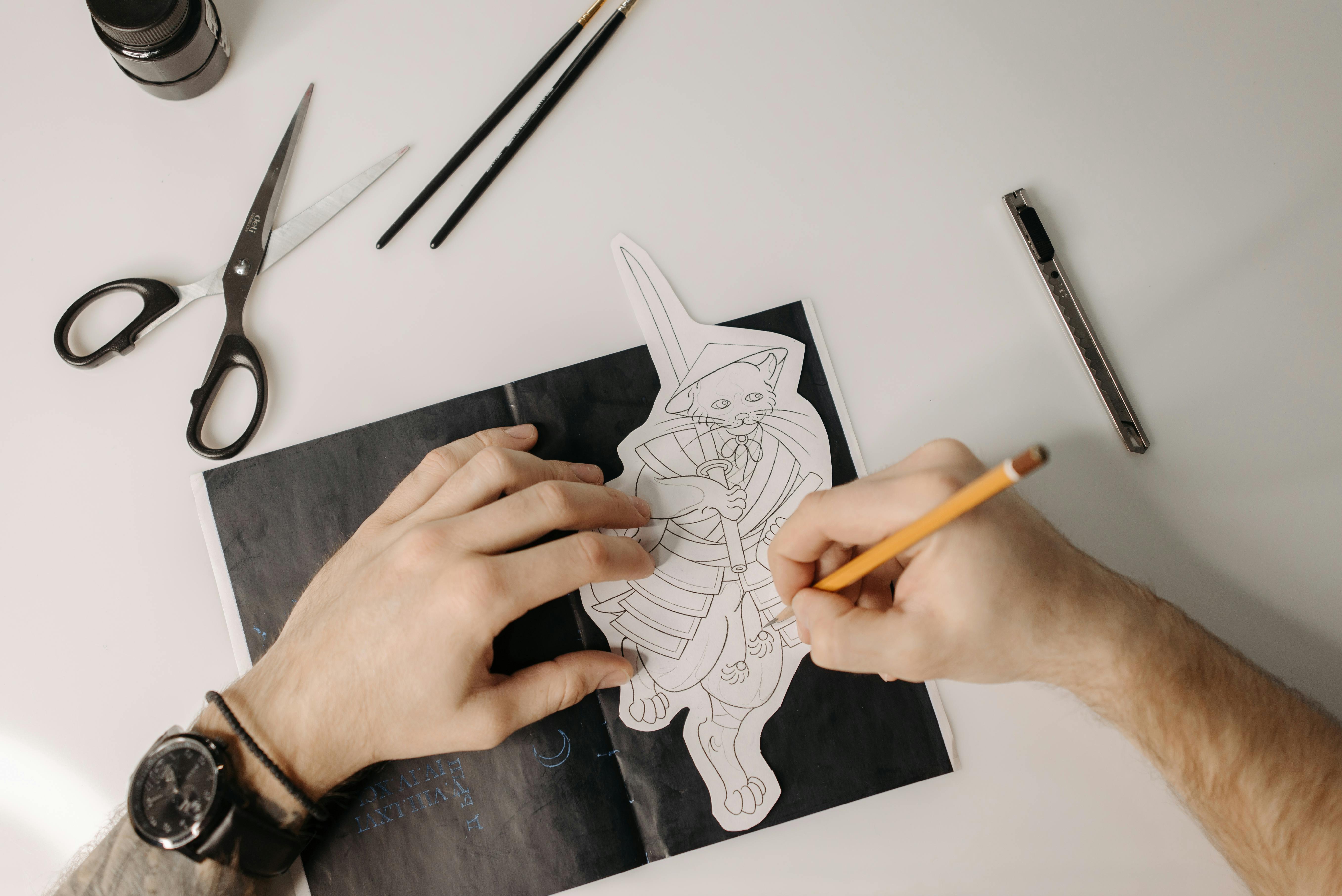 A Person Drawing on White Paper · Free Stock Photo