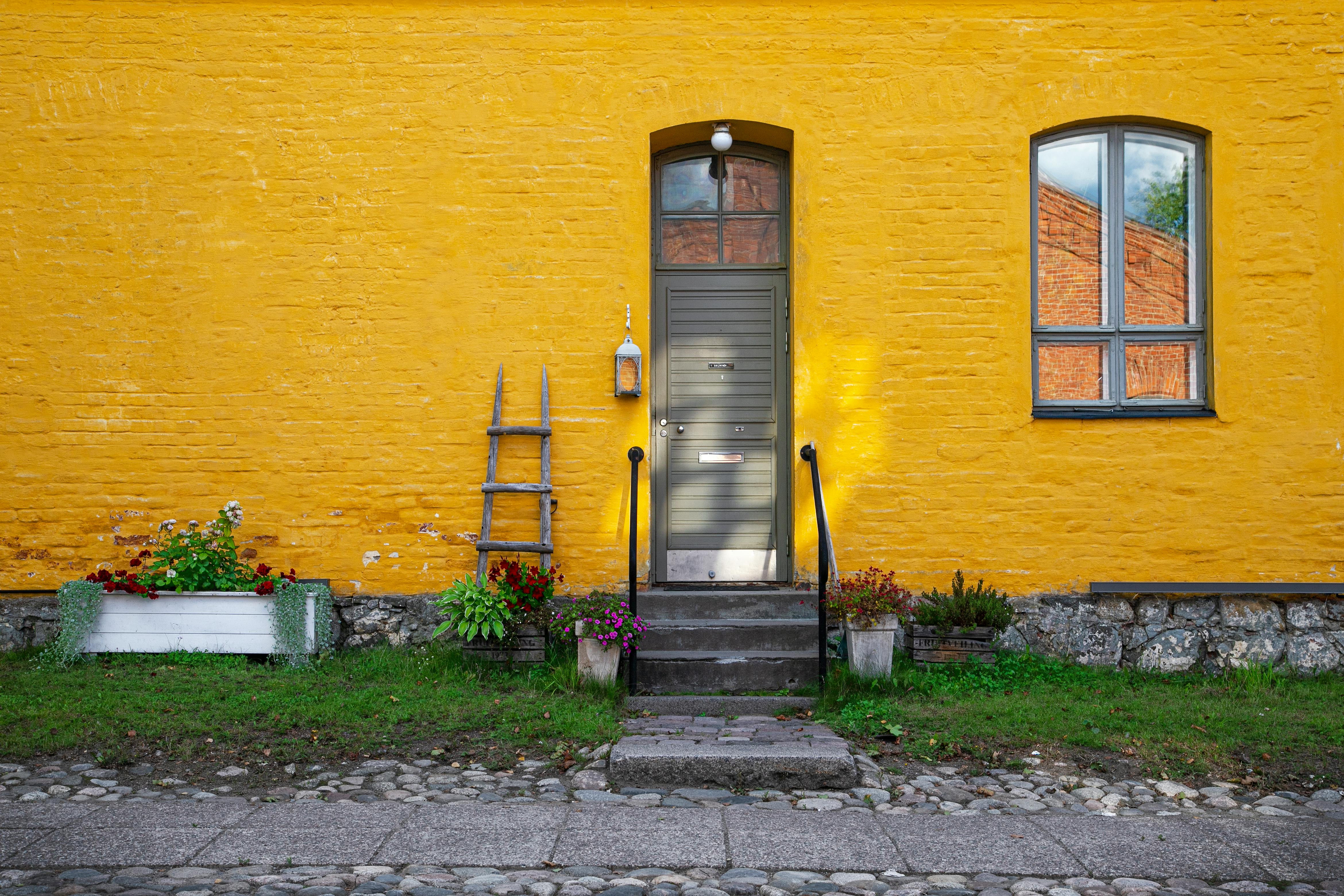 A House with a Yellow Wall · Free Stock Photo