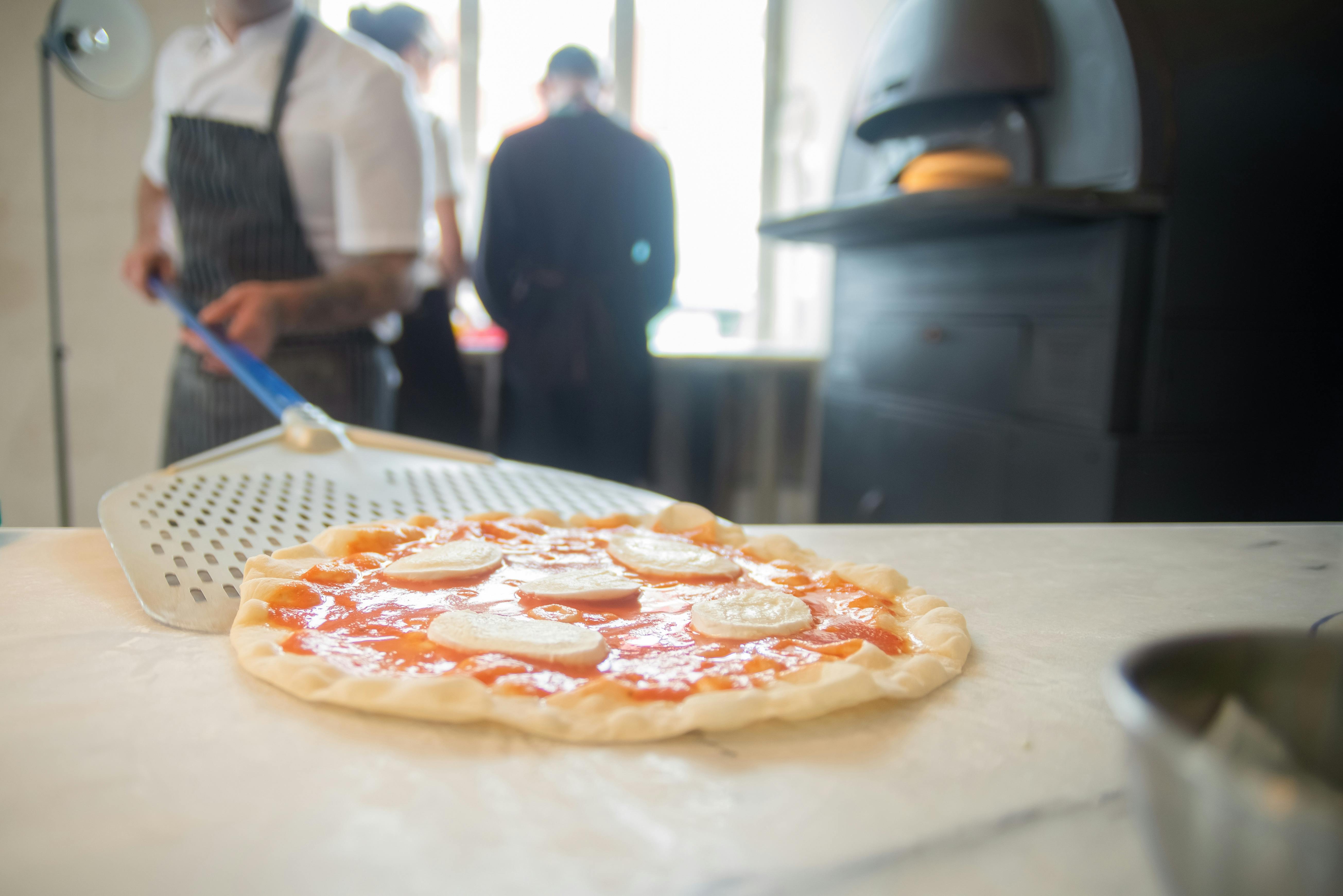 A Man Assembling a Cake · Free Stock Photo