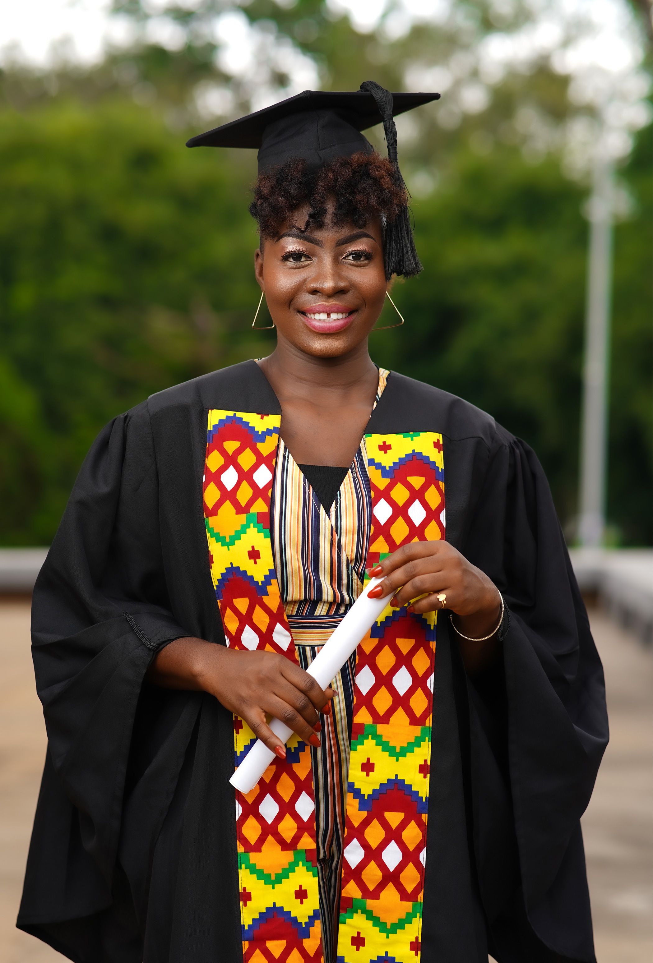 A Girl Wearing a Graduation Gown · Free Stock Photo