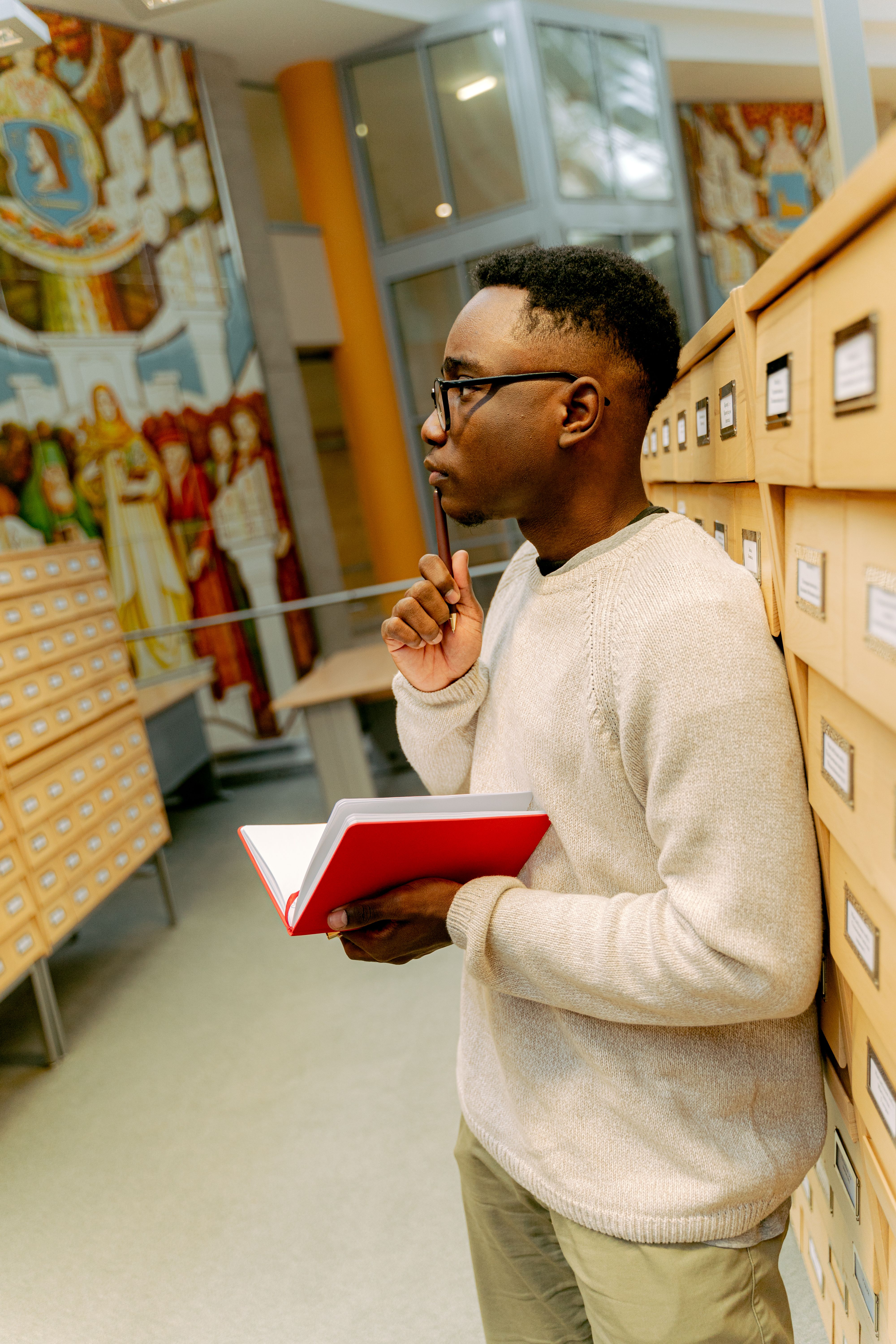 A Man Holding Red Notebook · Free Stock Photo