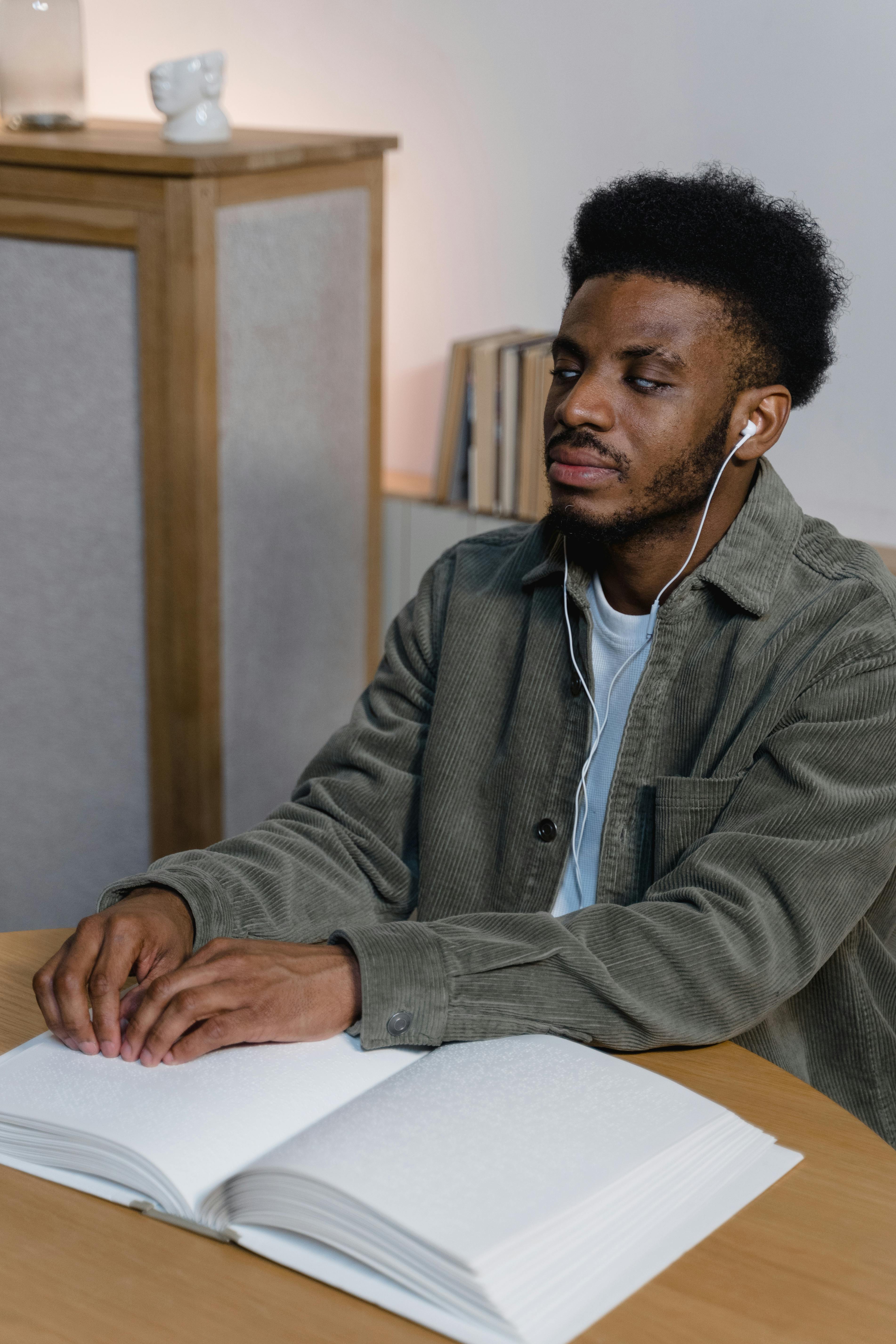 A Man Reading Braille · Free Stock Photo