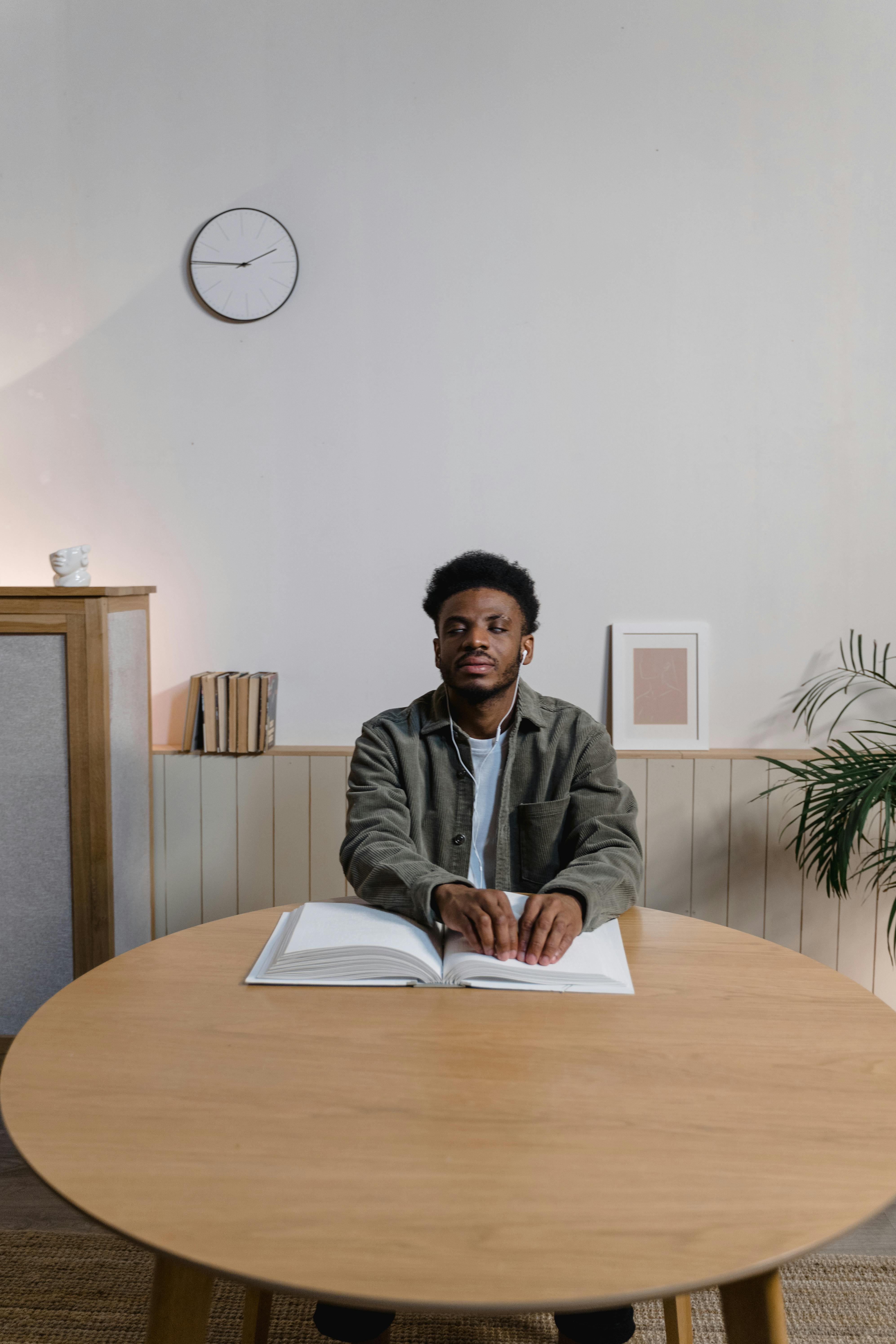 A Man Sitting at the Table · Free Stock Photo
