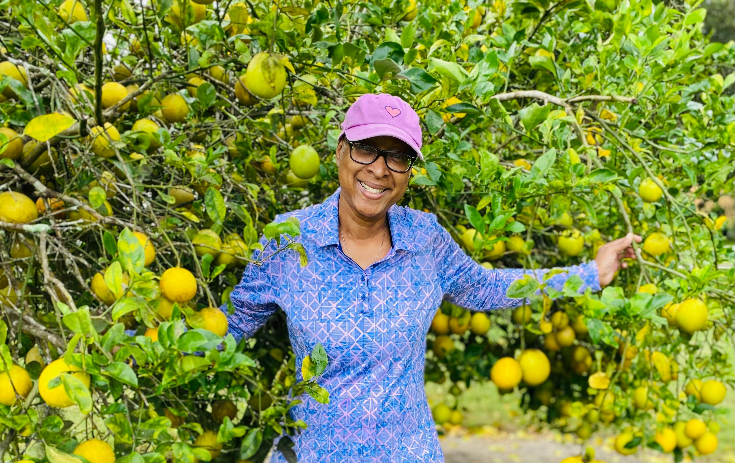 Woman Standing in Front of Lemon Tree · Free Stock Photo