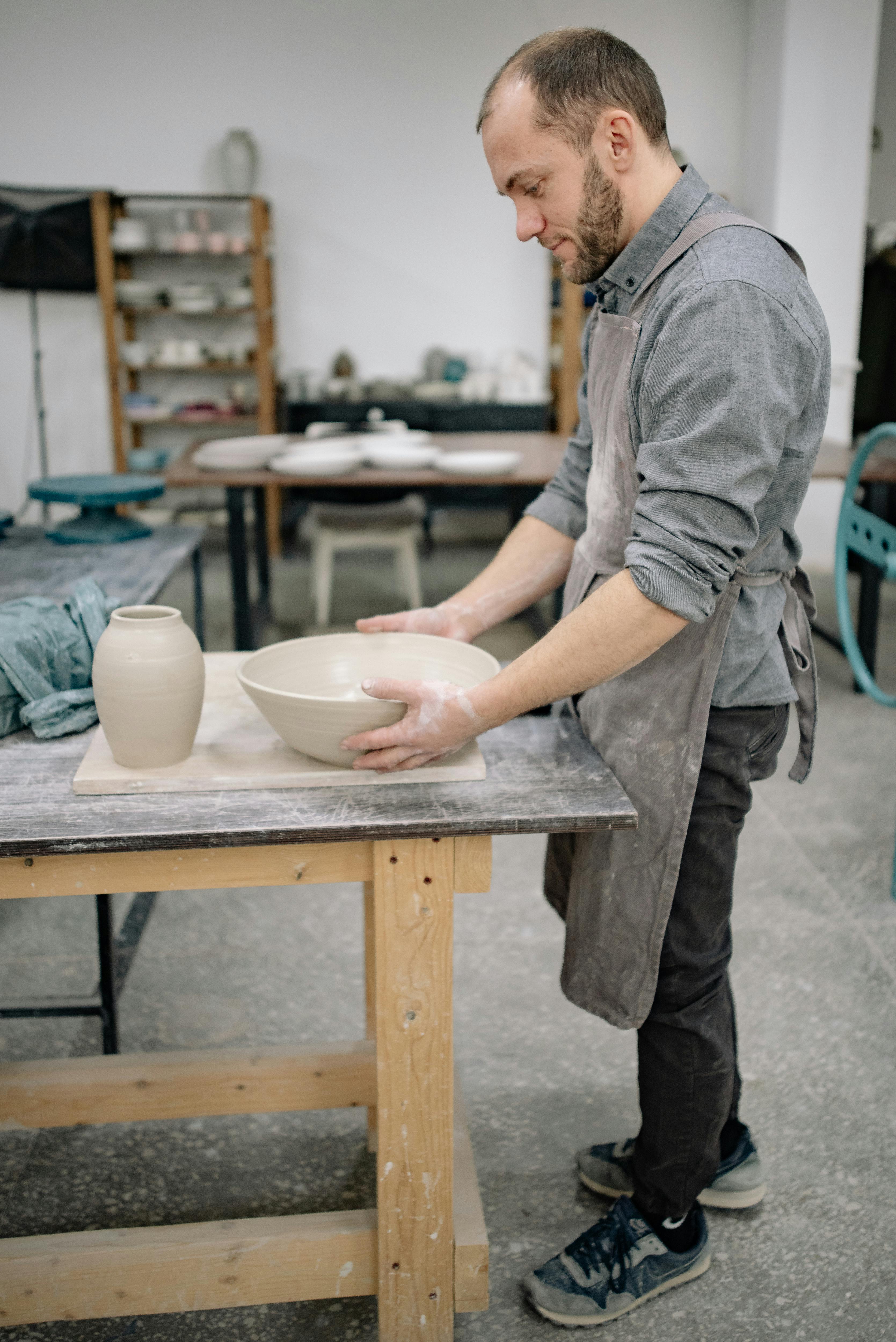 Man Creating Pottery at Workshop · Free Stock Photo
