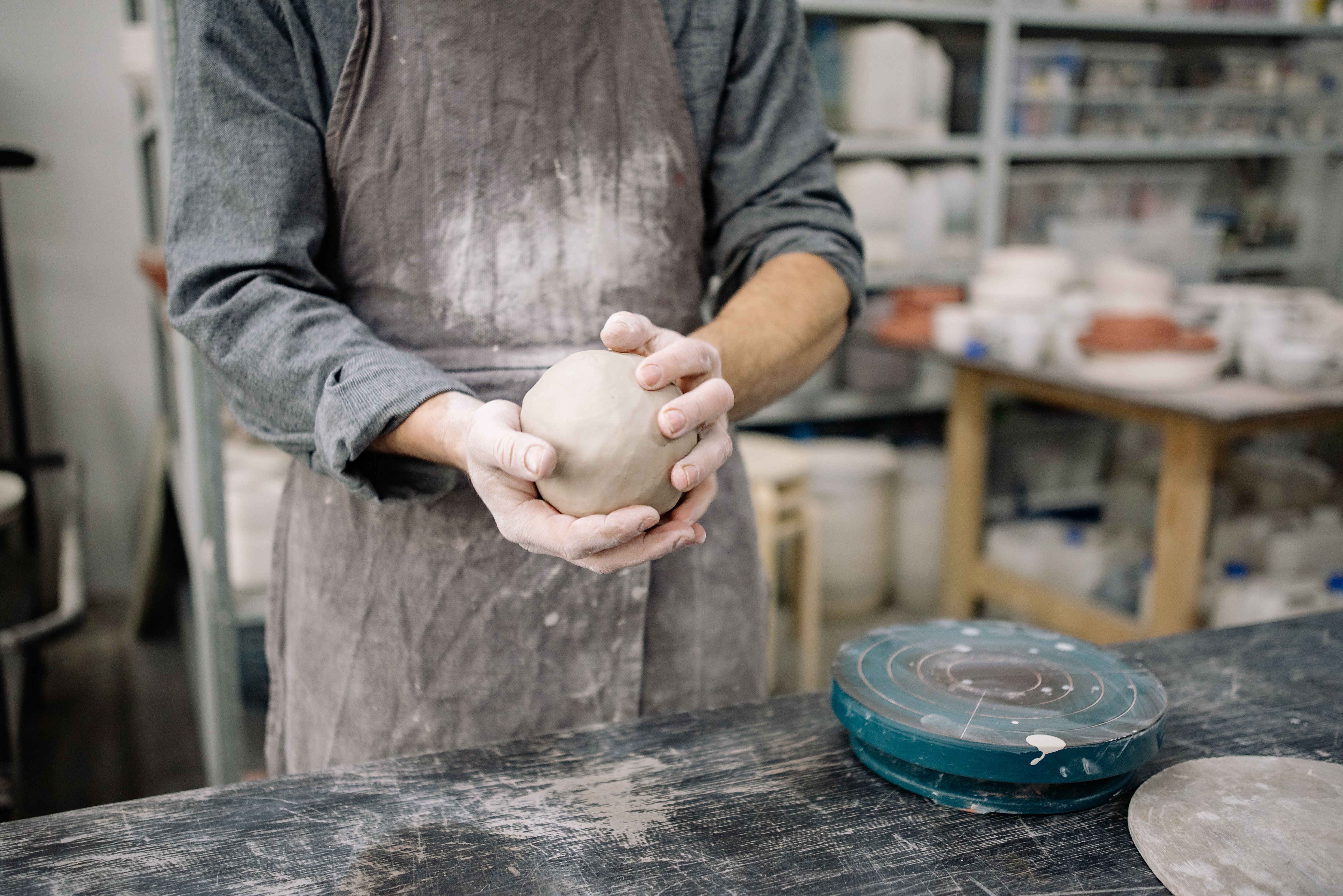 Man Holding a Ball of Clay · Free Stock Photo