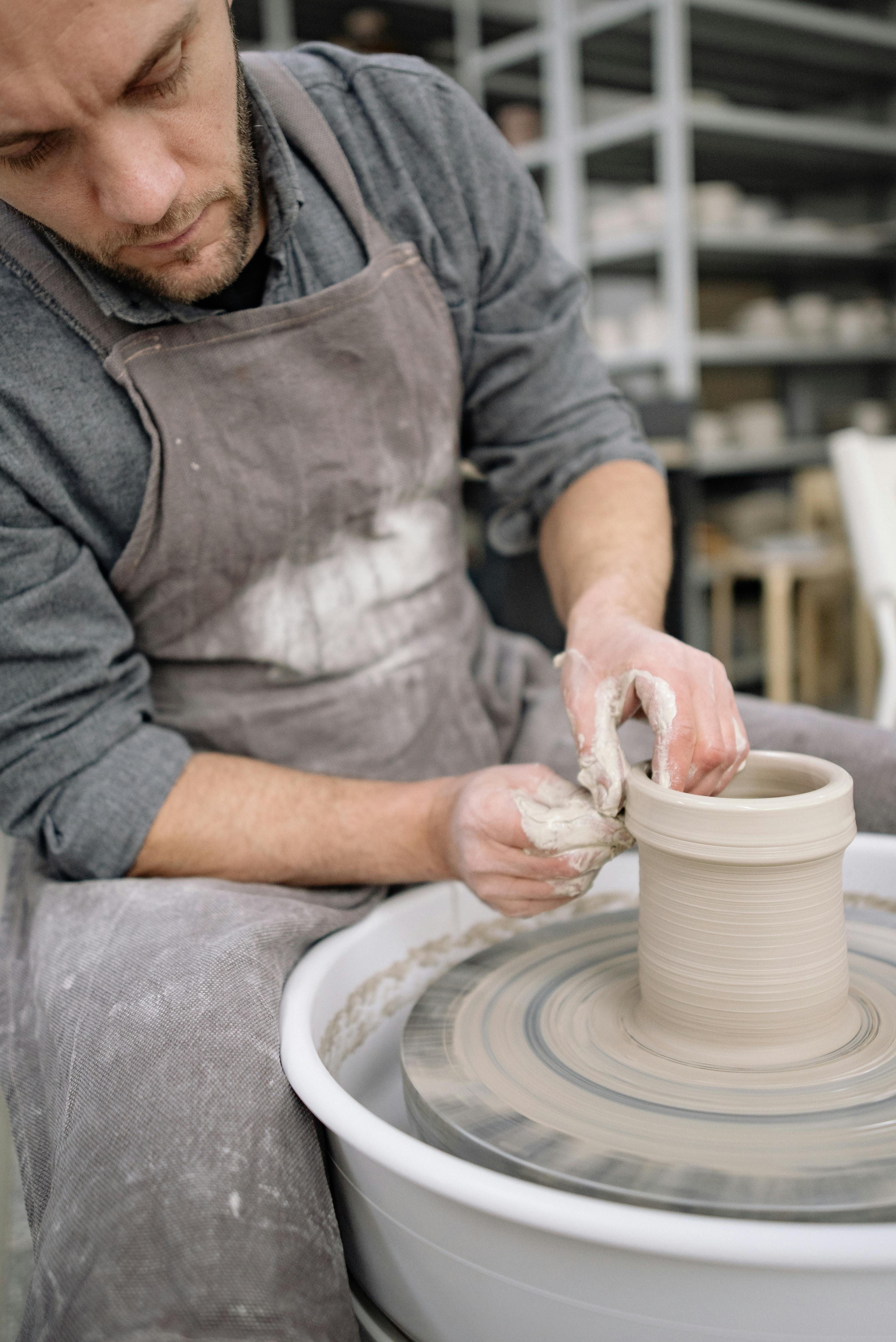 Man Doing Pottery at Workshop · Free Stock Photo
