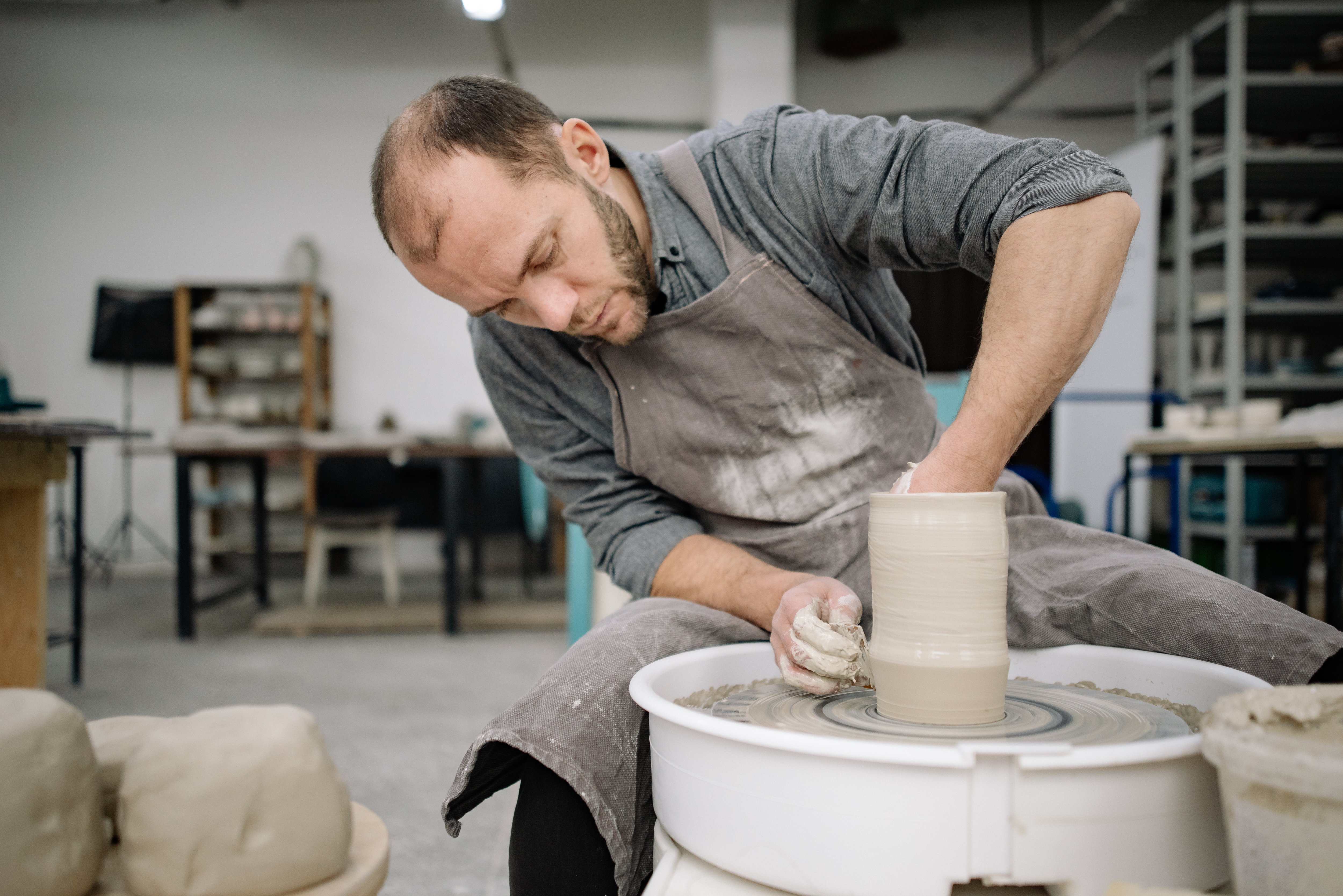 Man Working on a Pottery Wheel · Free Stock Photo