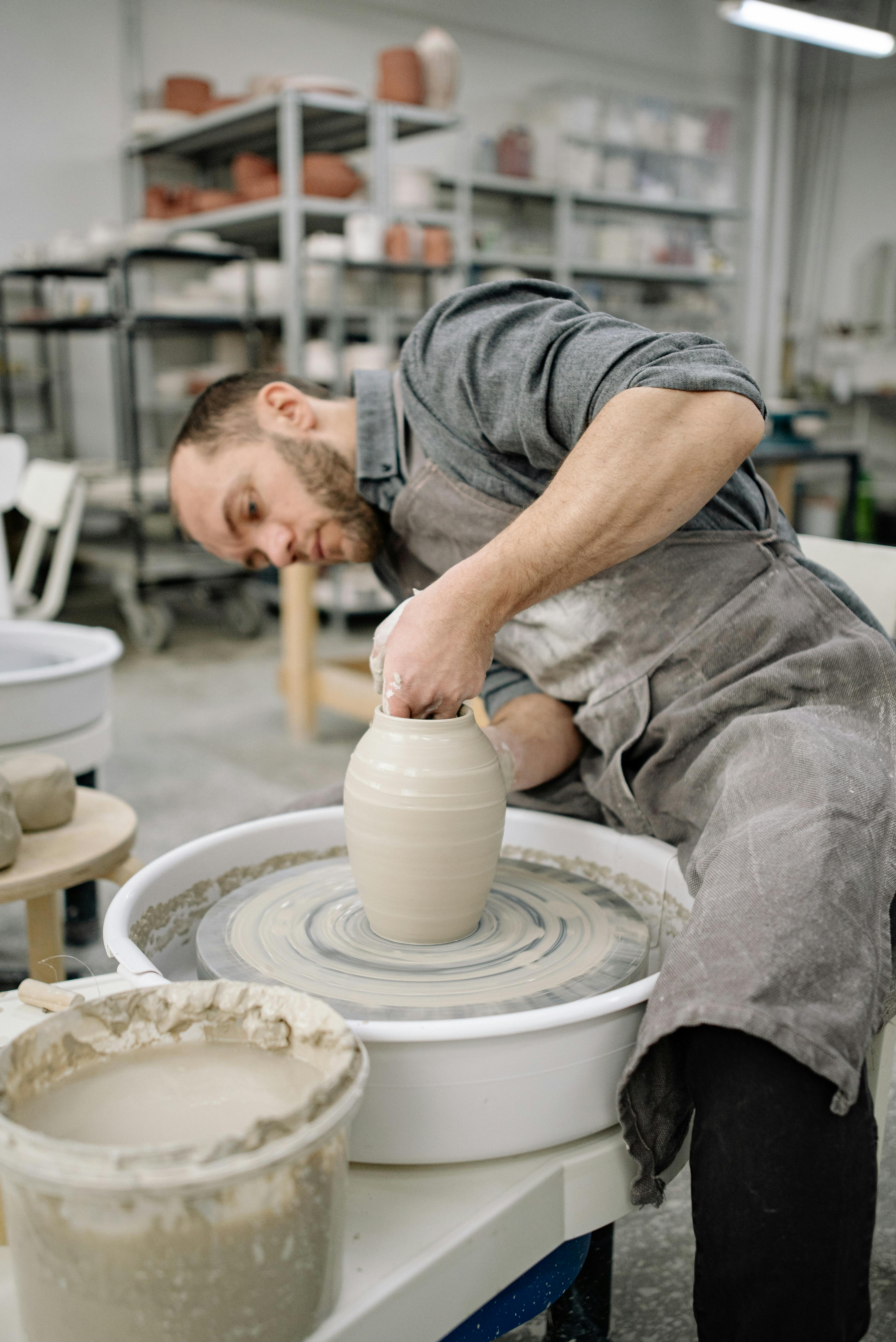 Man Creating Pottery at Workshop · Free Stock Photo