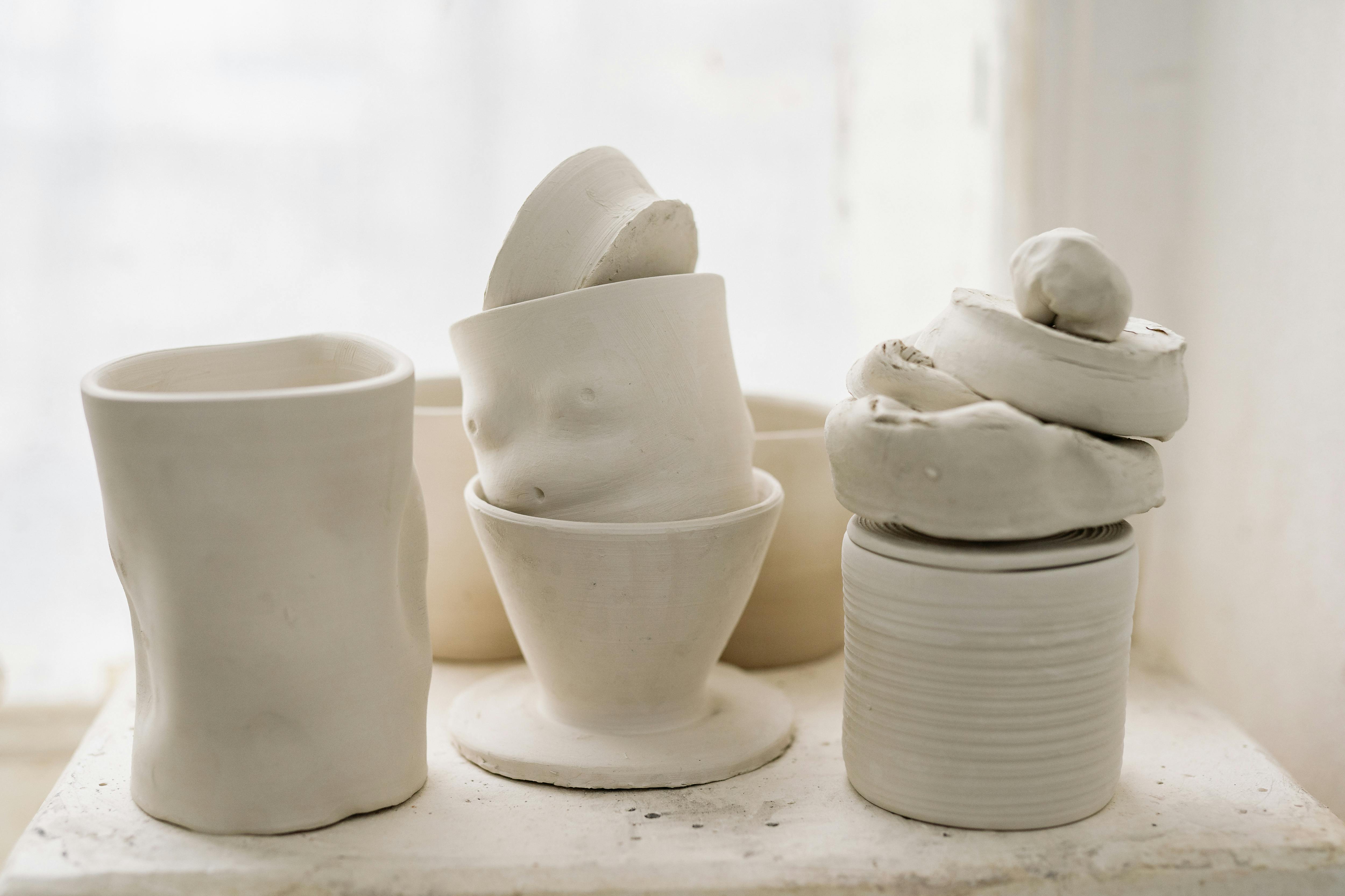A Variety of Unglazed White Ceramic Containers · Free Stock Photo