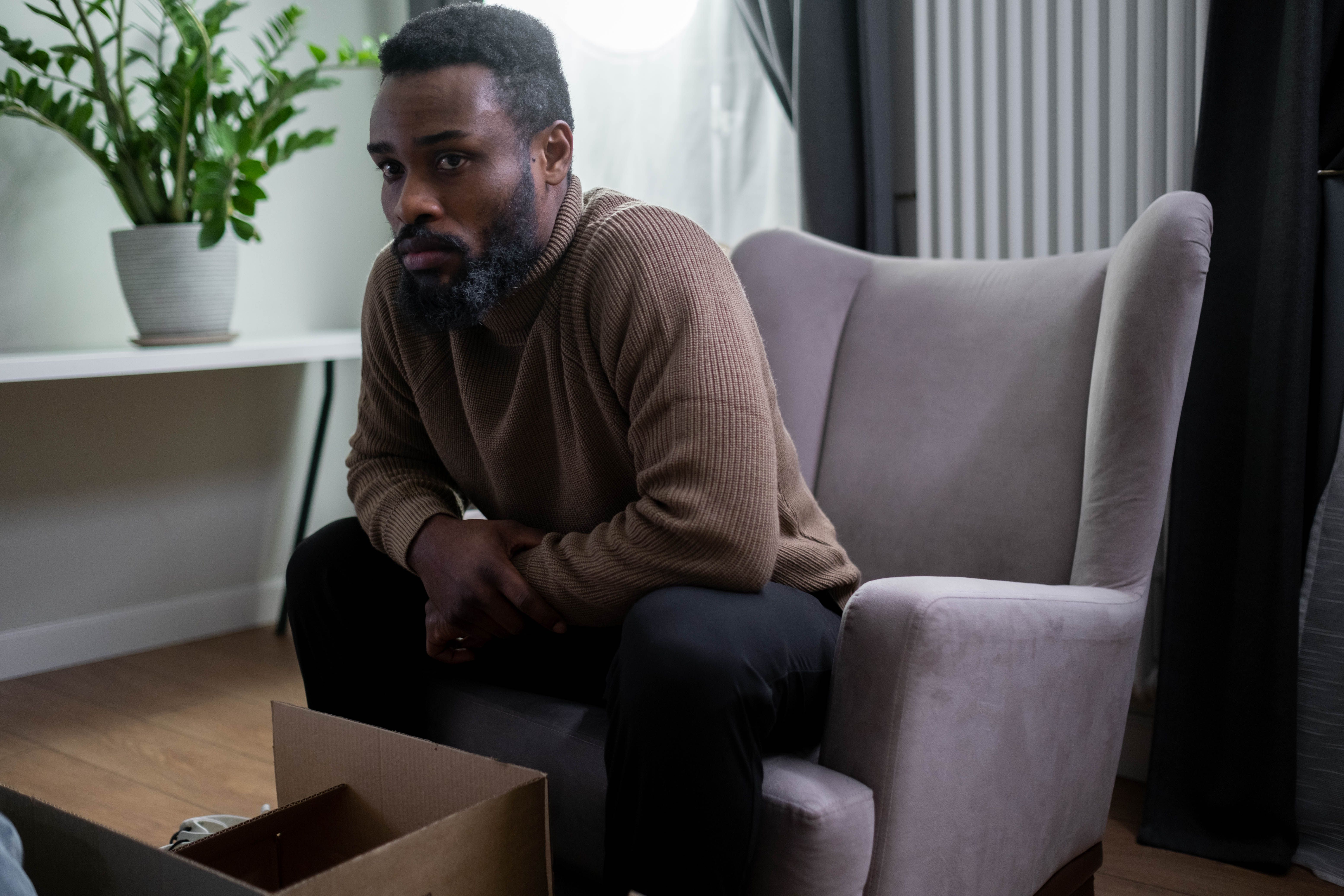 Two Men Sitting on a Sofa · Free Stock Photo