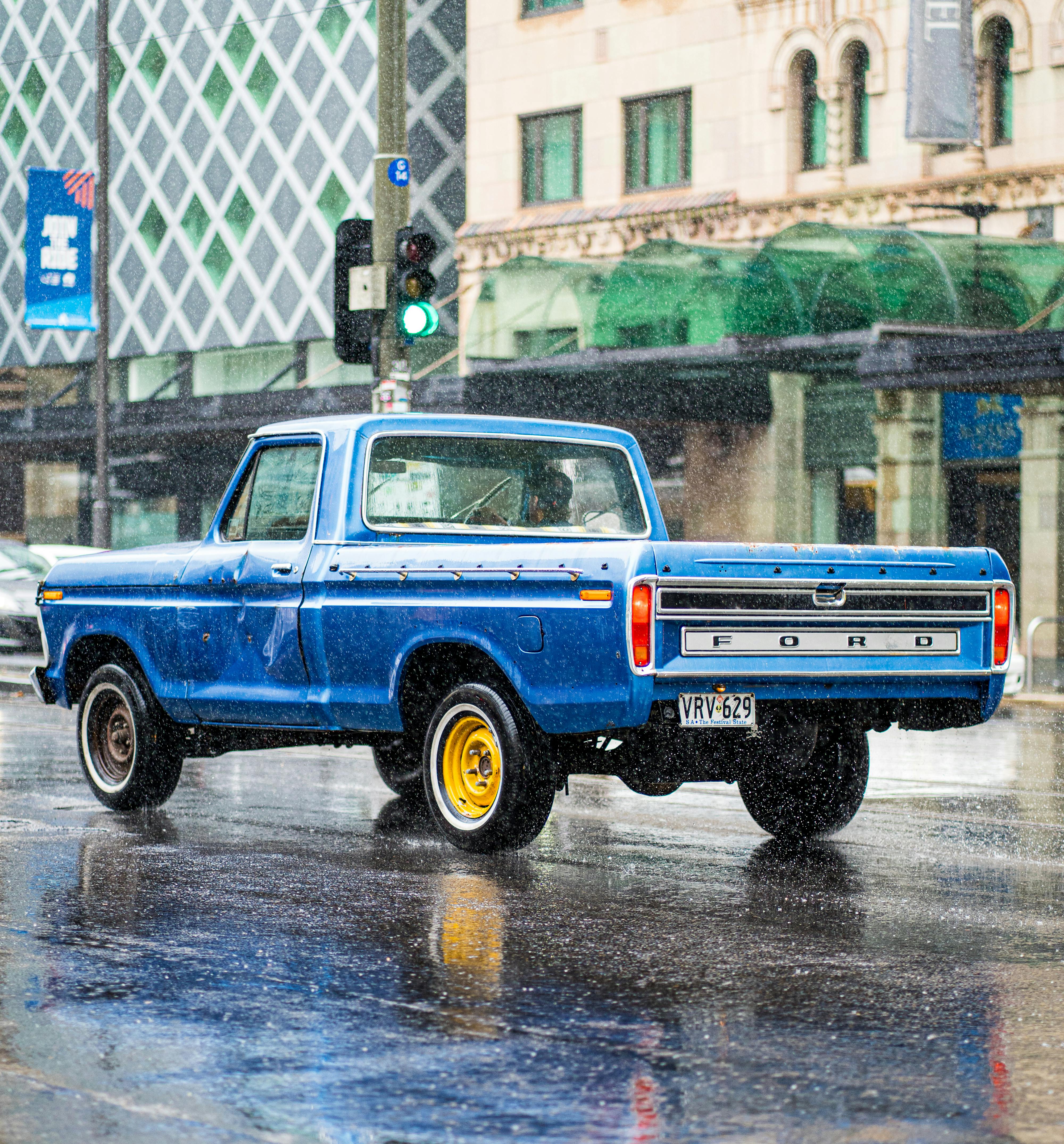 A Blue Pickup Truck on the Road · Free Stock Photo