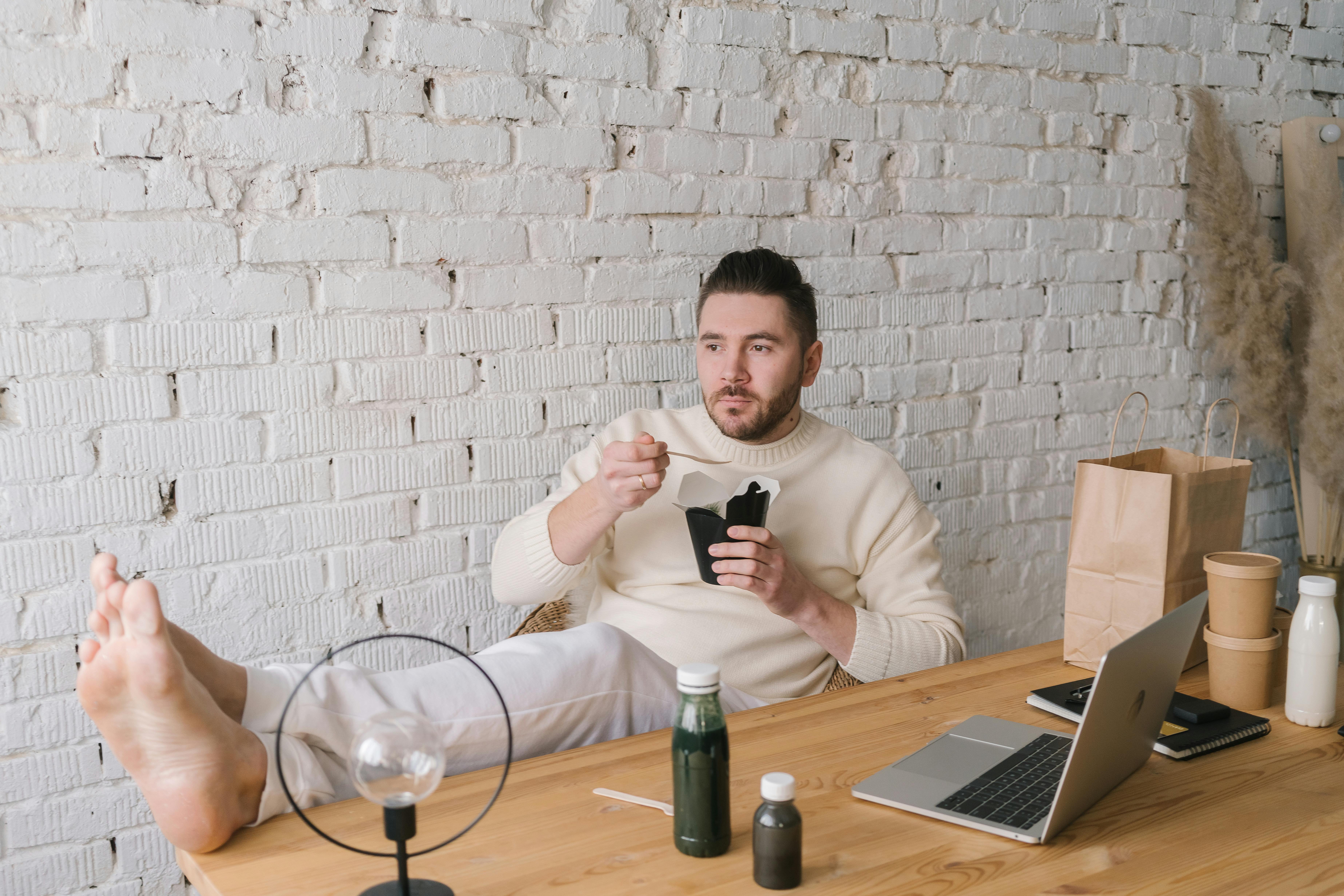 A Man Eating Food in the Box · Free Stock Photo