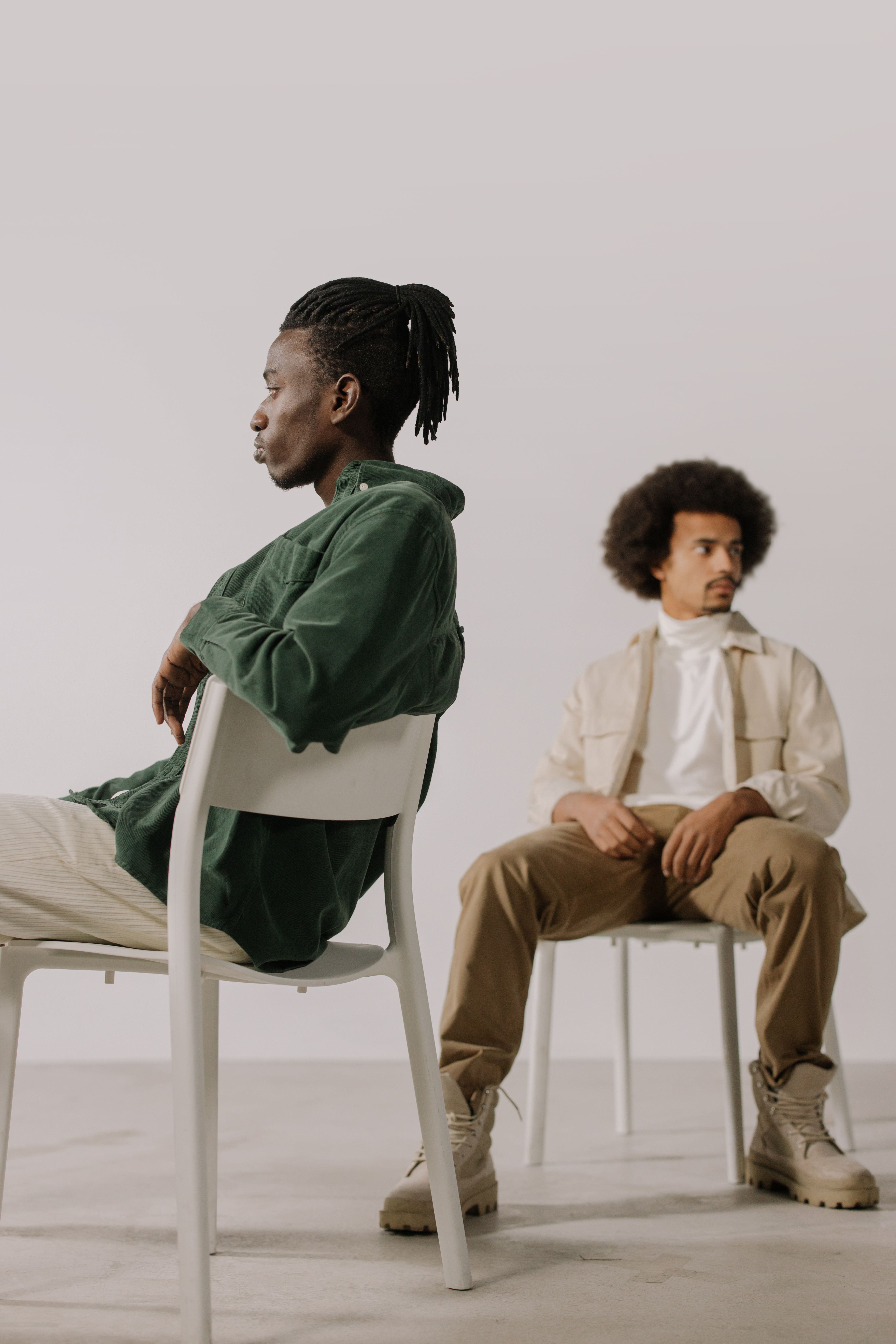 Handsome Men Sitting on Chairs · Free Stock Photo