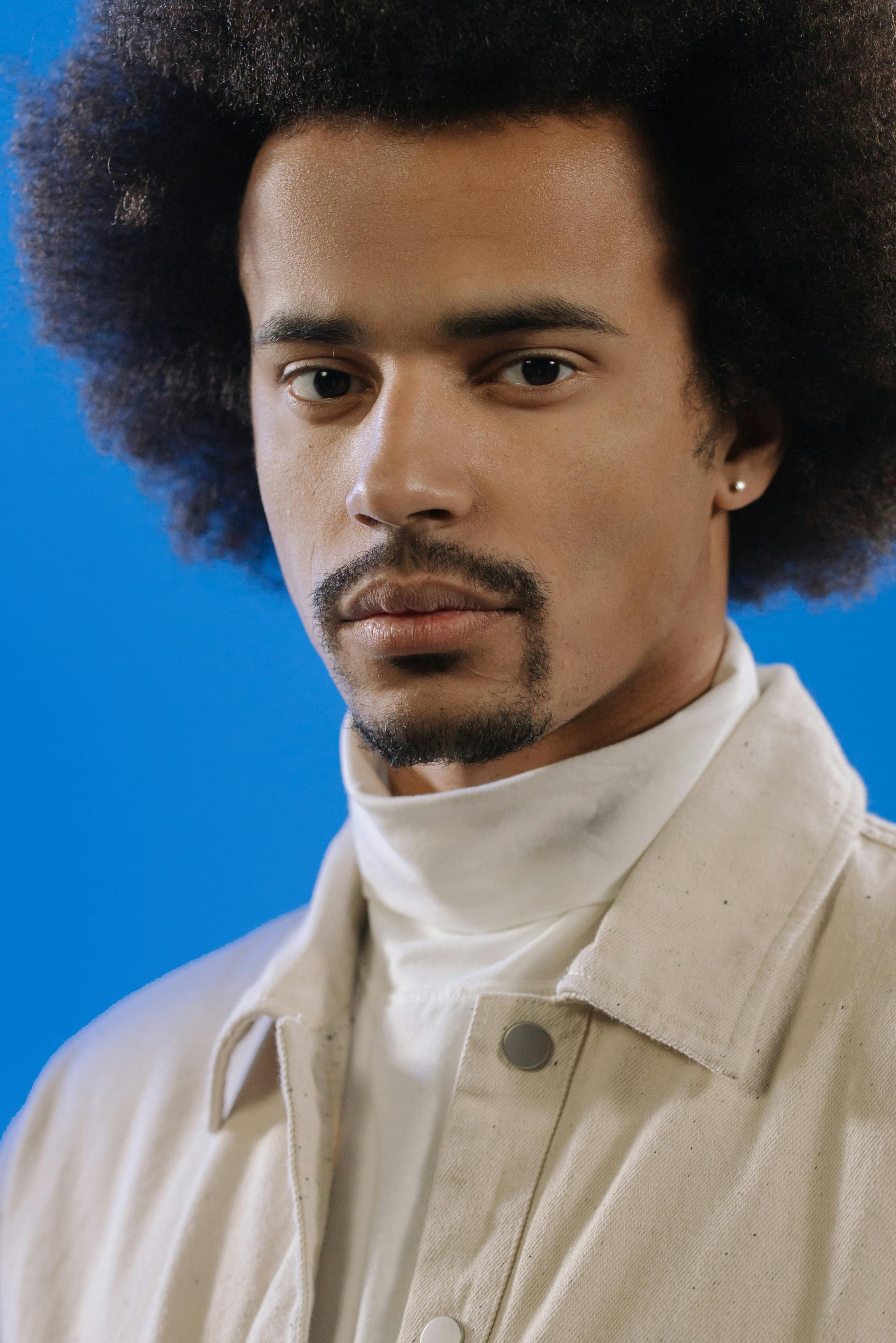 A Man with Goatee and an Afro Hairstyle · Free Stock Photo