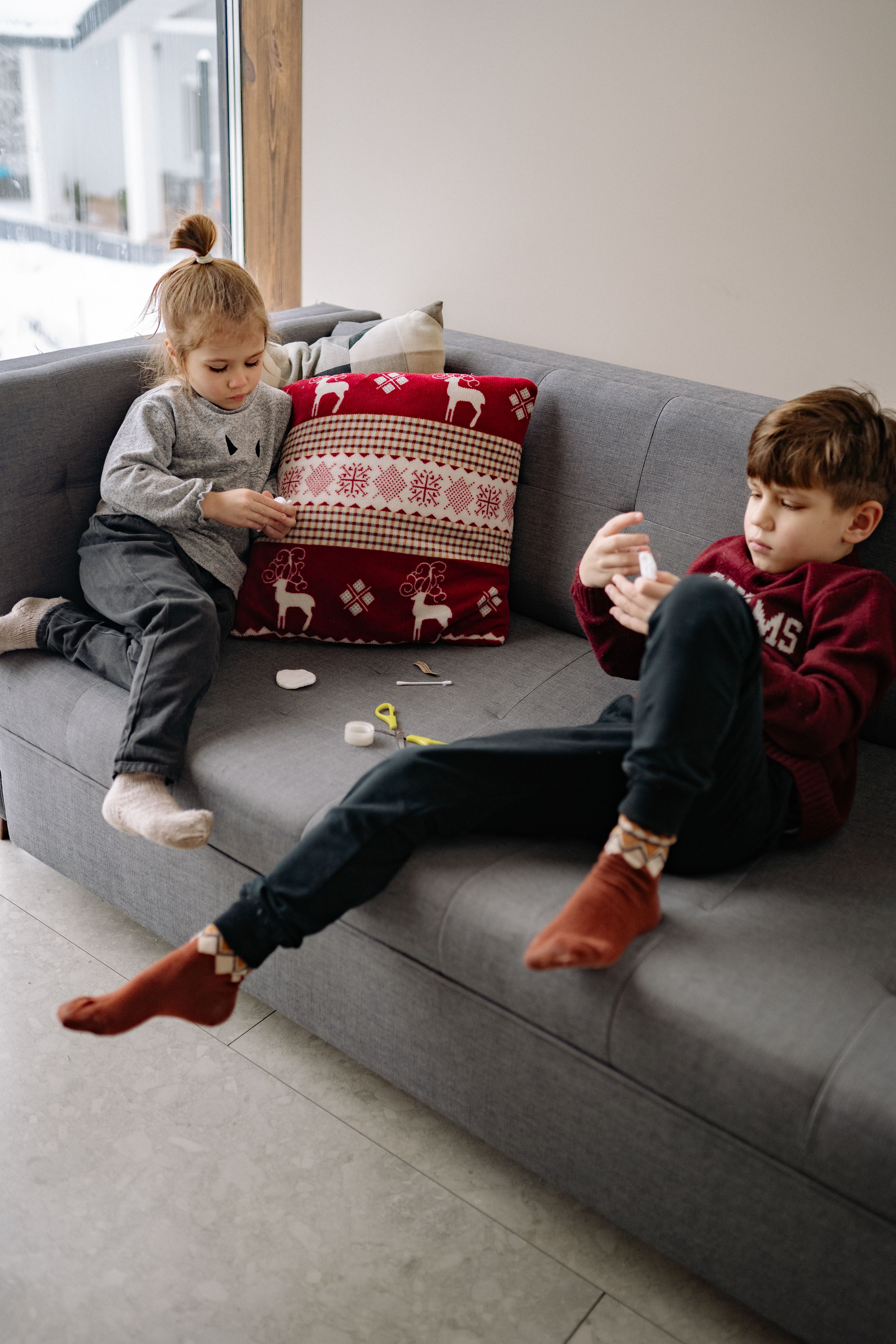 Photo of Two Kids Sitting on Sofa · Free Stock Photo