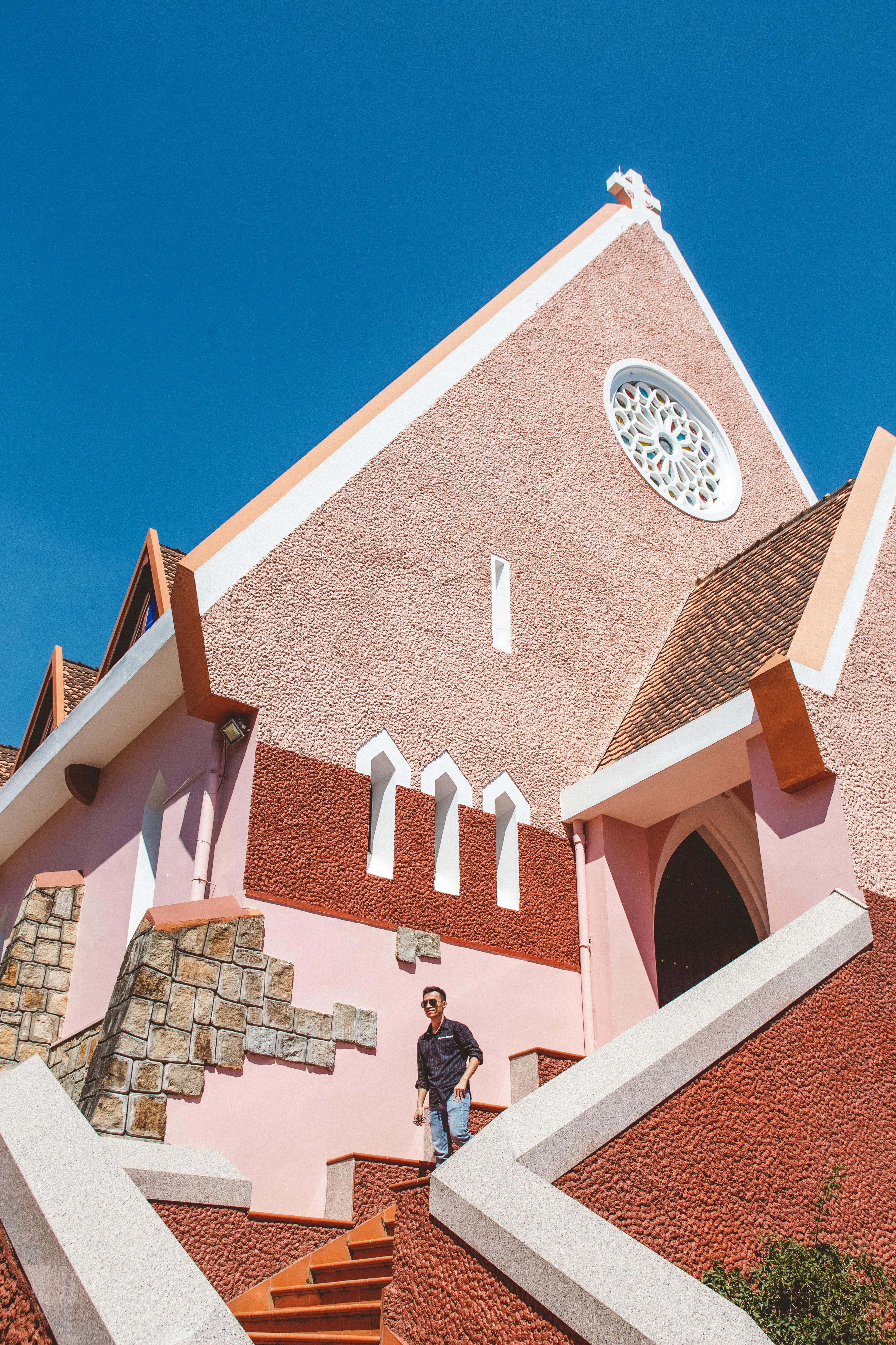 Man Walking Down Church Steps · Free Stock Photo