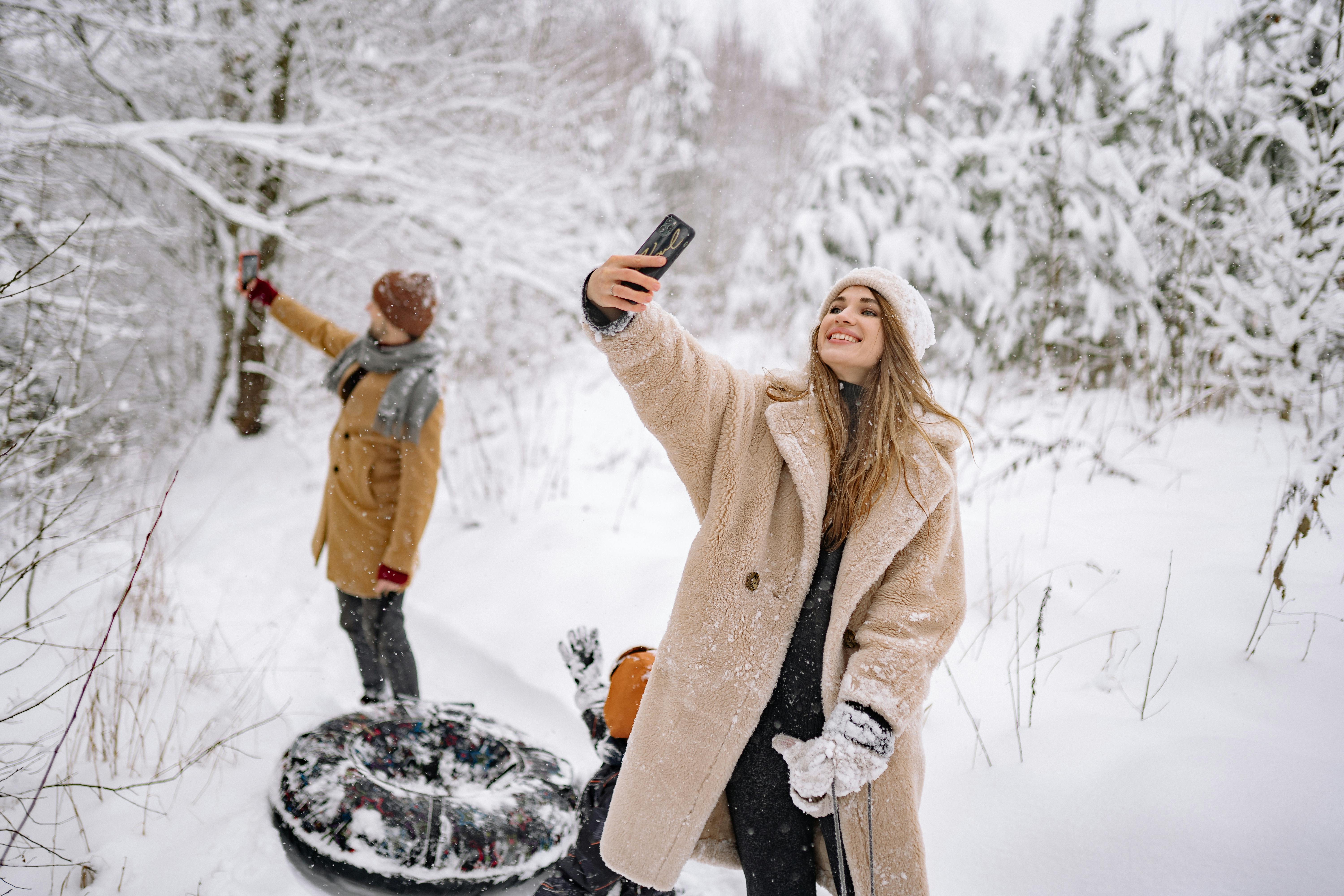 Woman in Mittens Covering her Face on a Winter Day · Free Stock Photo